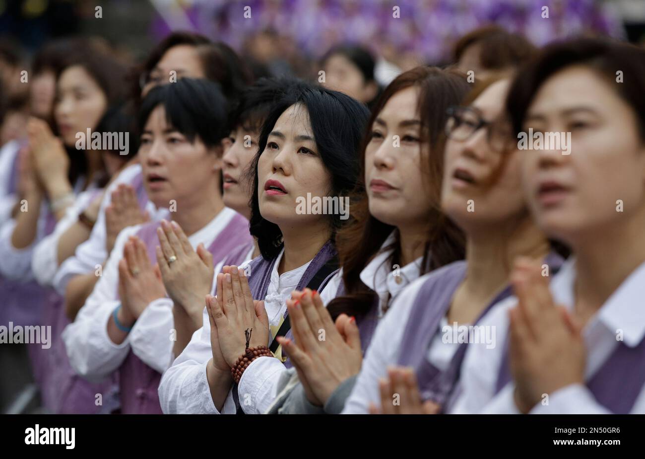 South Korean Buddhists pray during a Buddhist ceremony for cherishing ... South Korean Buddhists pray during a Buddhist ceremony for cherishing ...