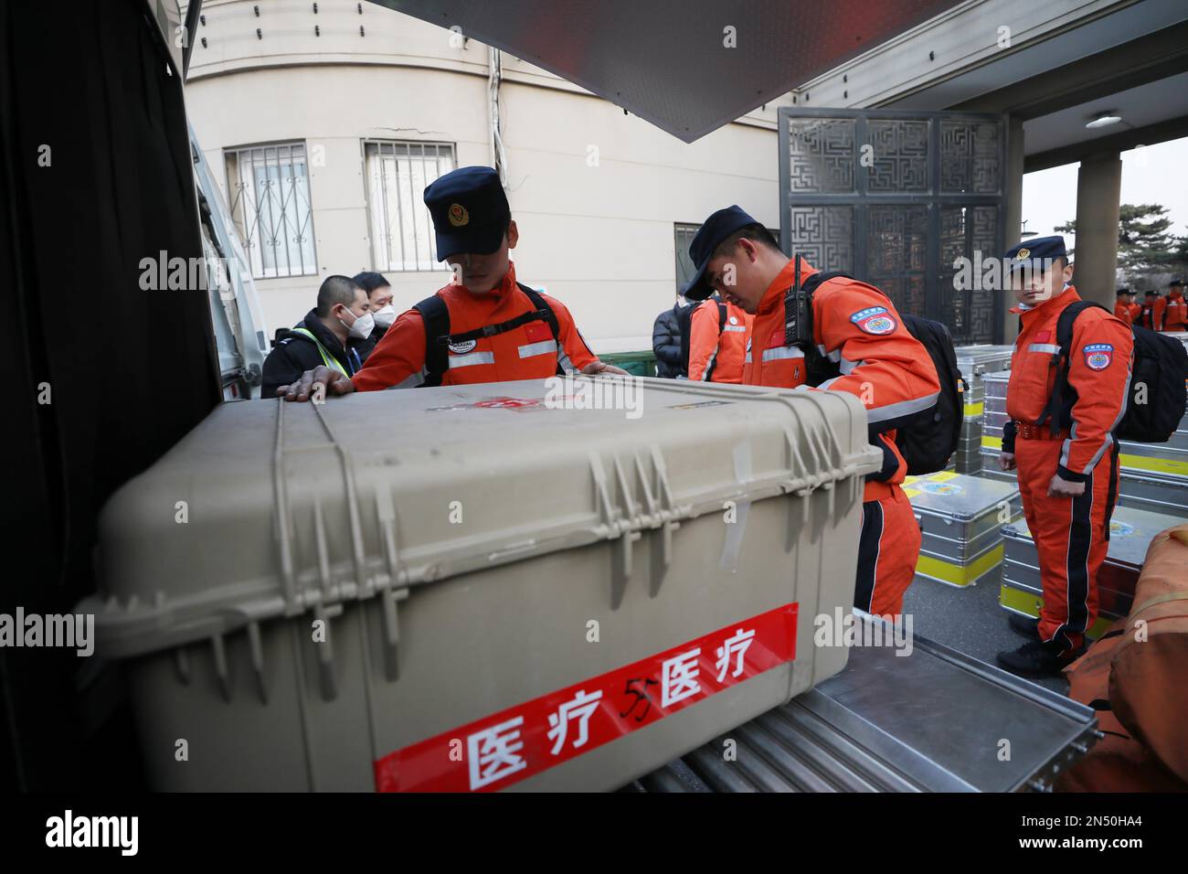 Members of a Chinese rescue team carry equipment and supplies before ...