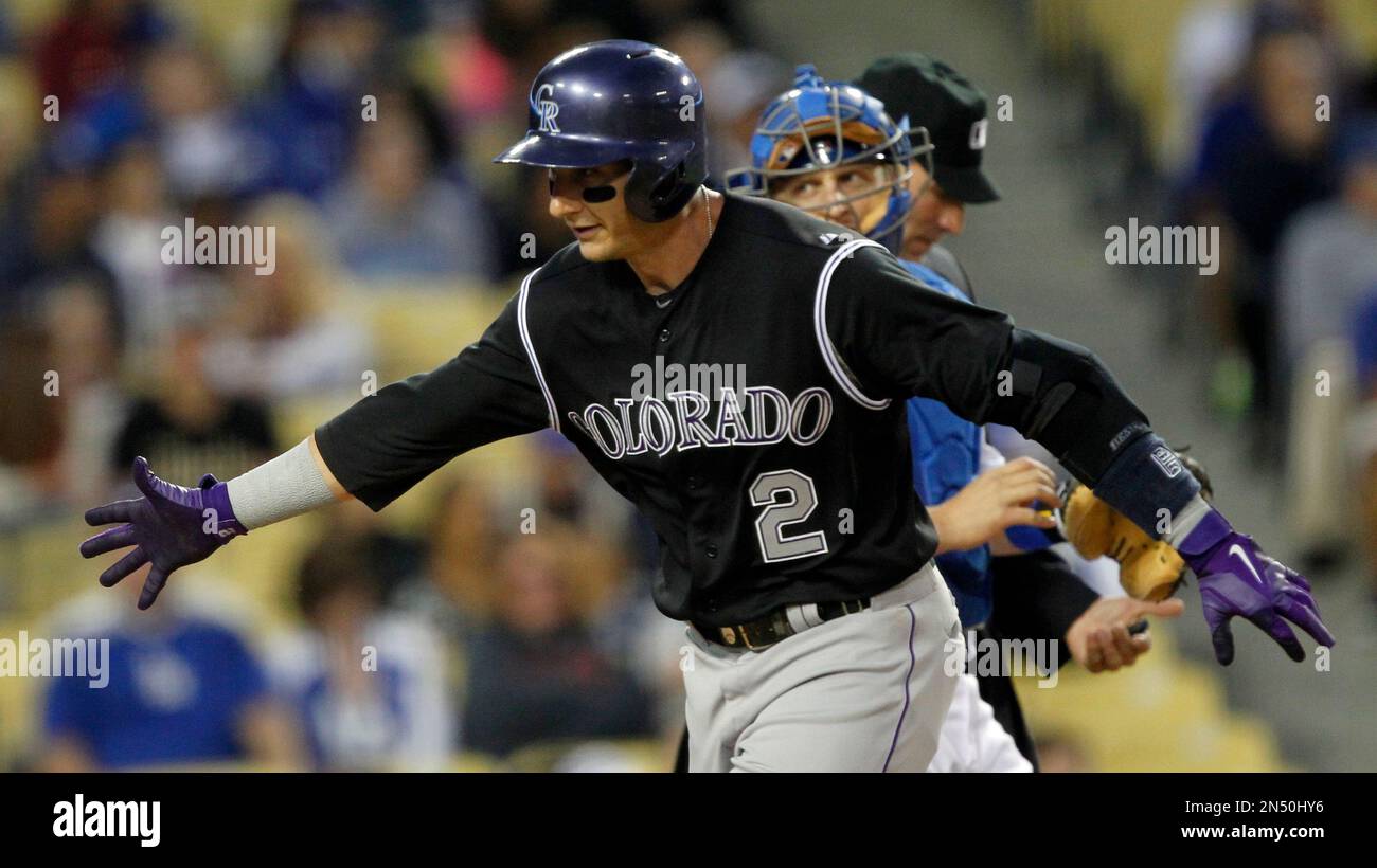 Colorado Rockies’ Troy Tulowitzki (2) reaches out for congratulations ...