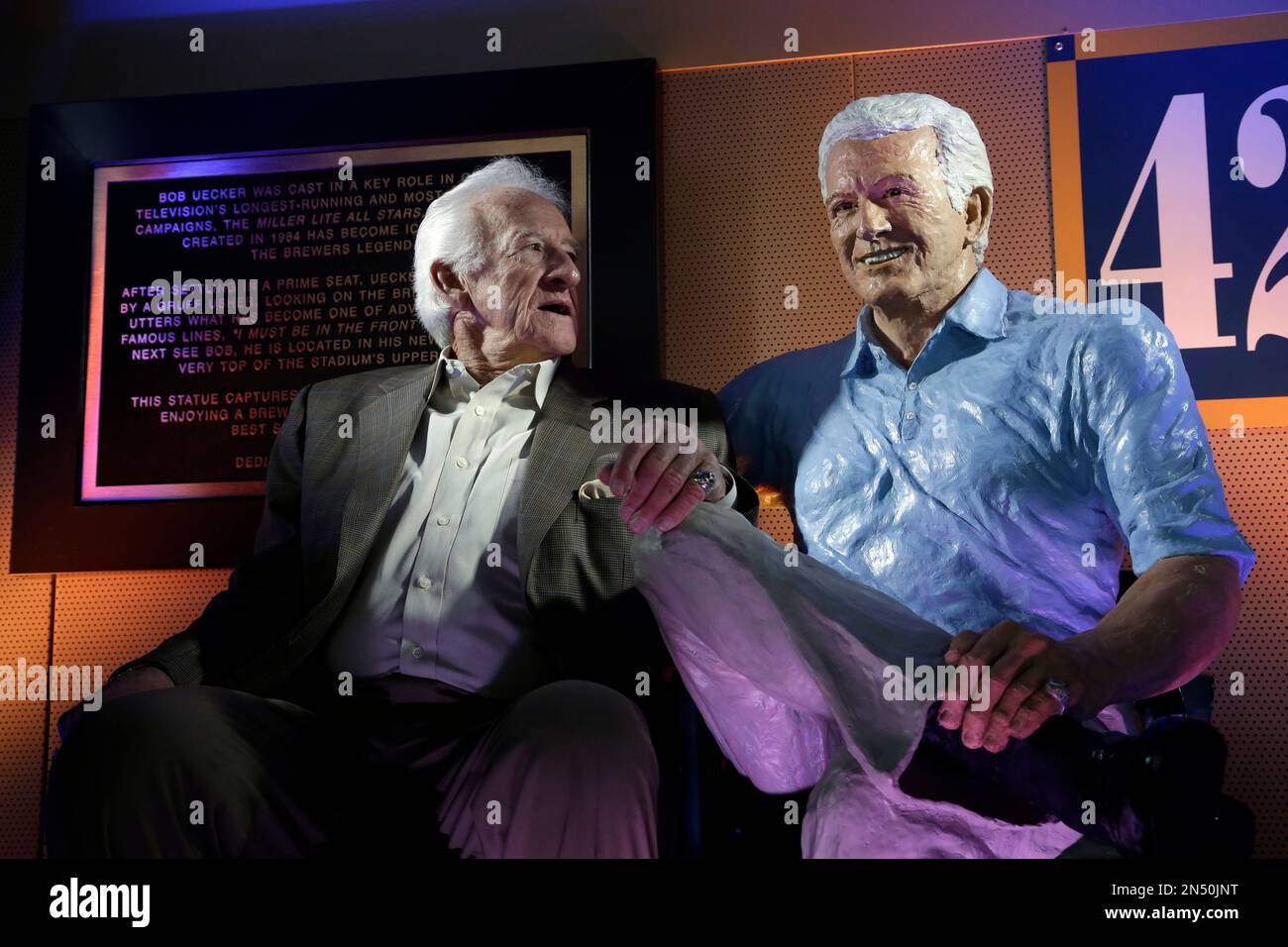 Milwaukee Brewers radio announcer Bob Uecker sits next to his statue ...