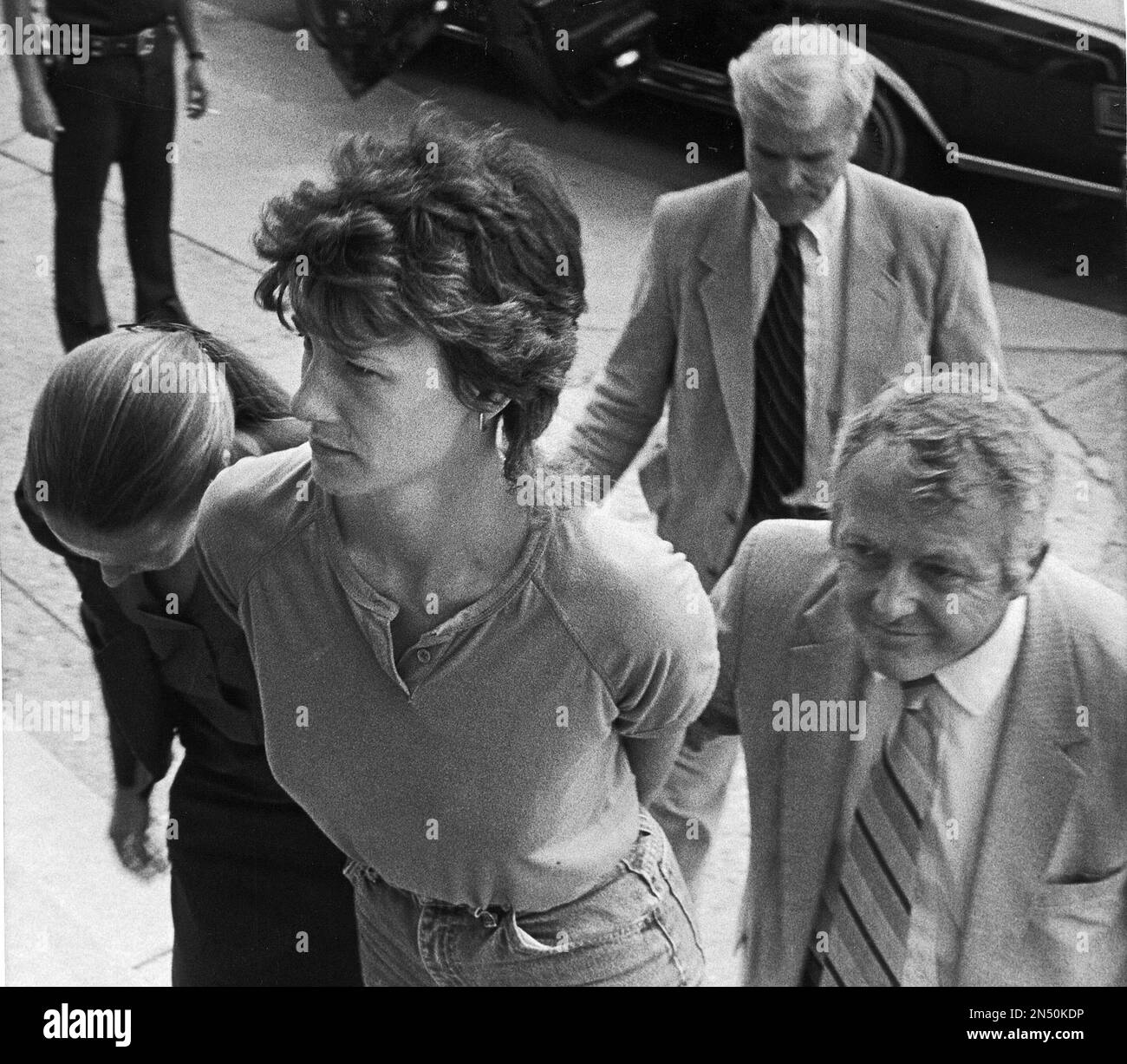 Carol Ann Manning is shown in the custody of FBI agents in Norfolk, Va ...