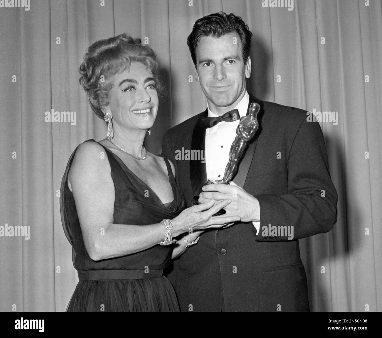 Maximilan Schell with Joan Crawford after she had presented him with ...