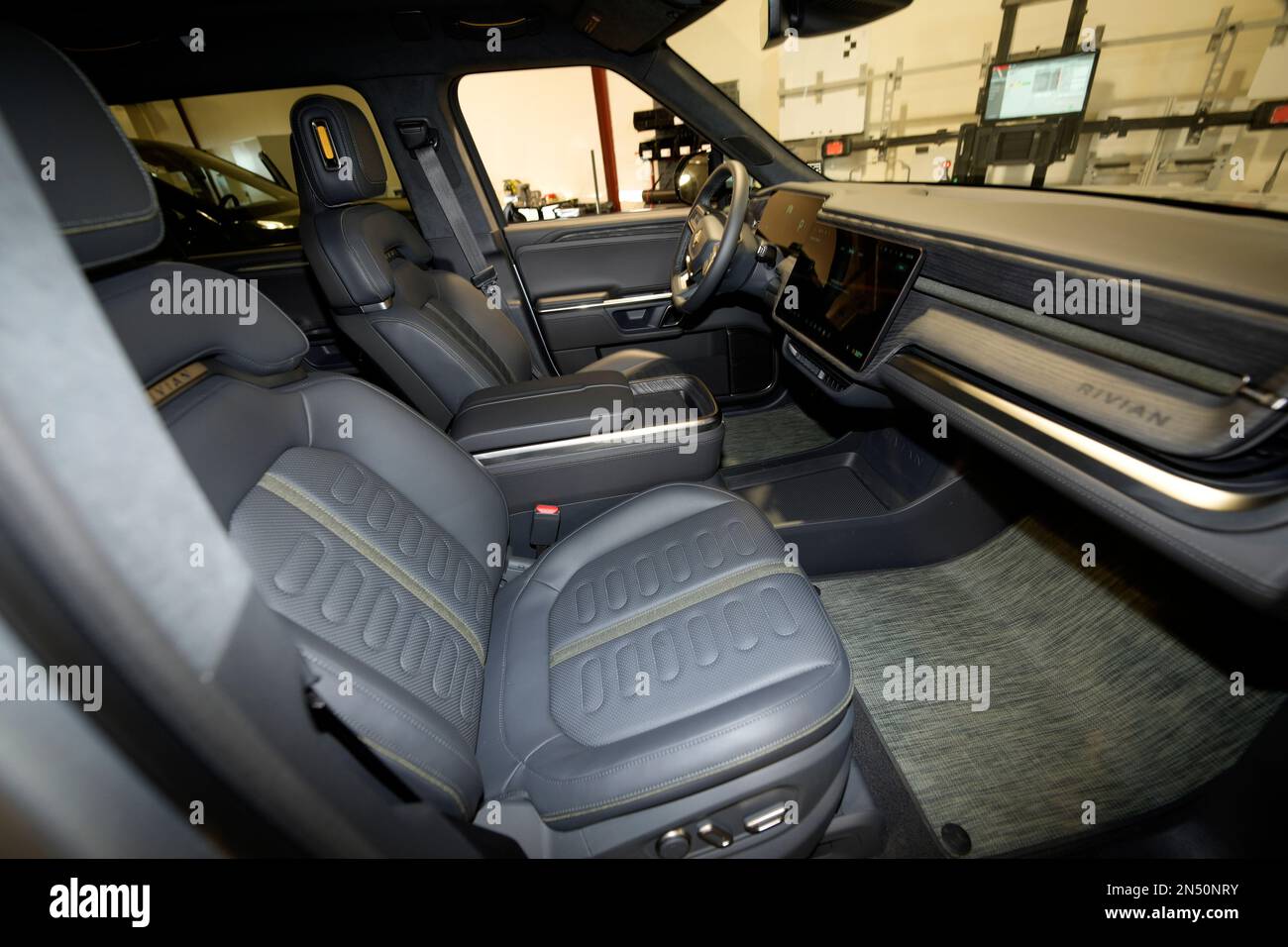 The interior of a 2023 R1S sports-utility vehicle is shown at a Rivian ...