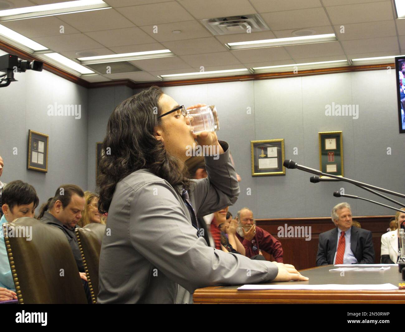 Dustin Soileau of Lafayette drinks a glass of raw milk after speaking ...