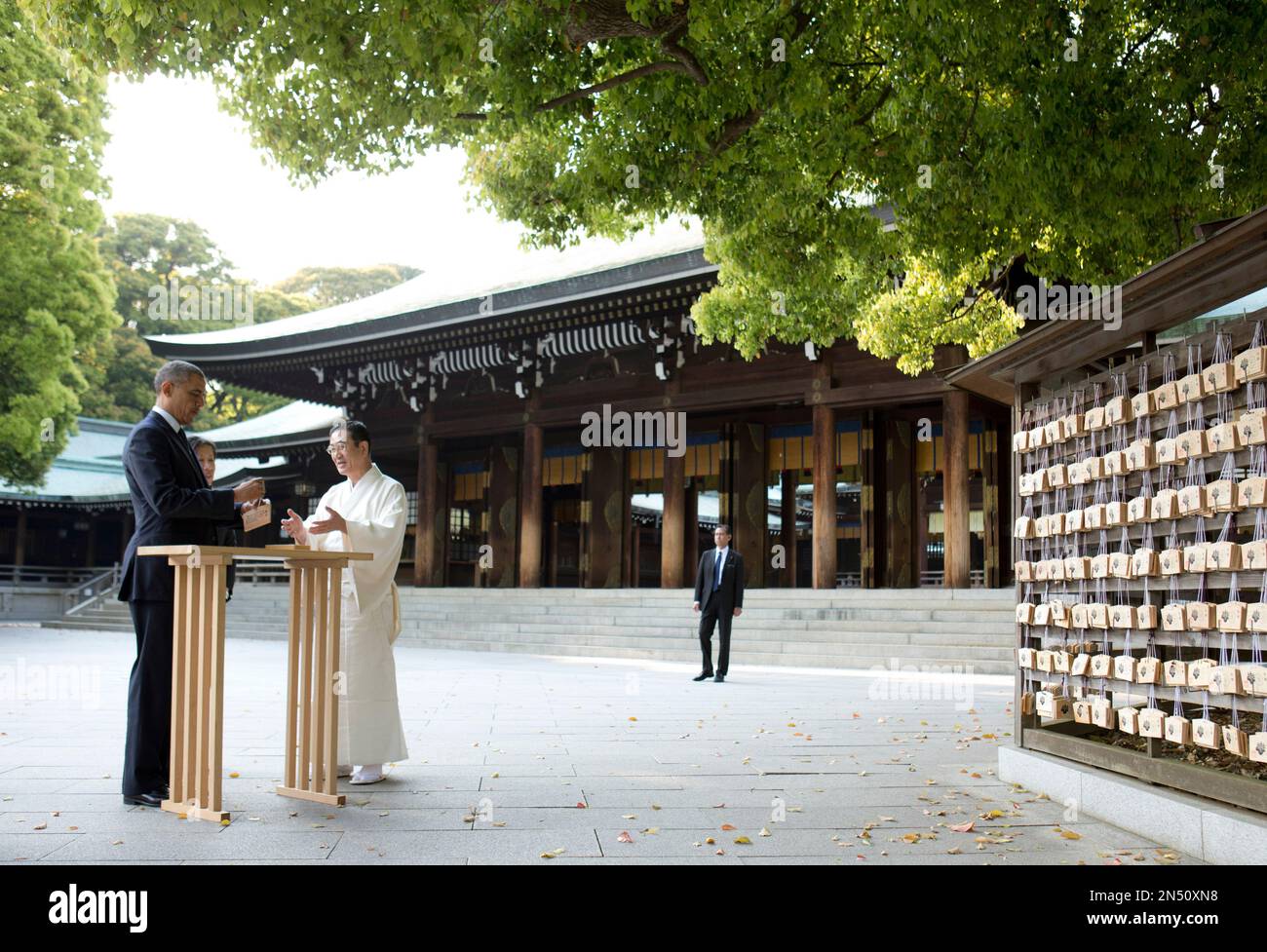 President Barack Obama holds his prayer tablet to place on the Votive ...