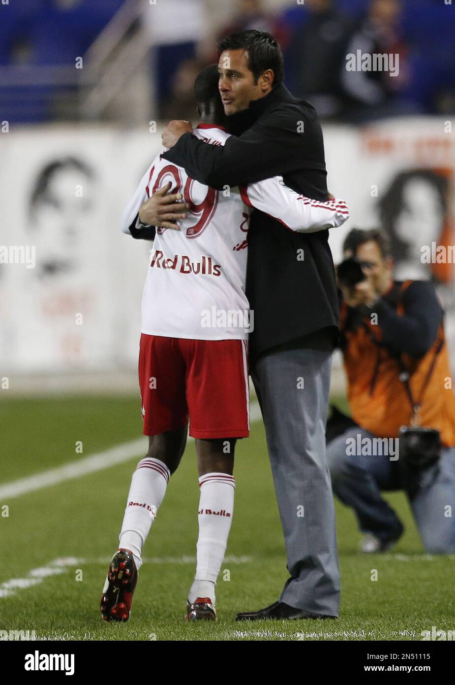 New York Red Bulls head coach Mike Petke, right, hugs forward Bradley ...