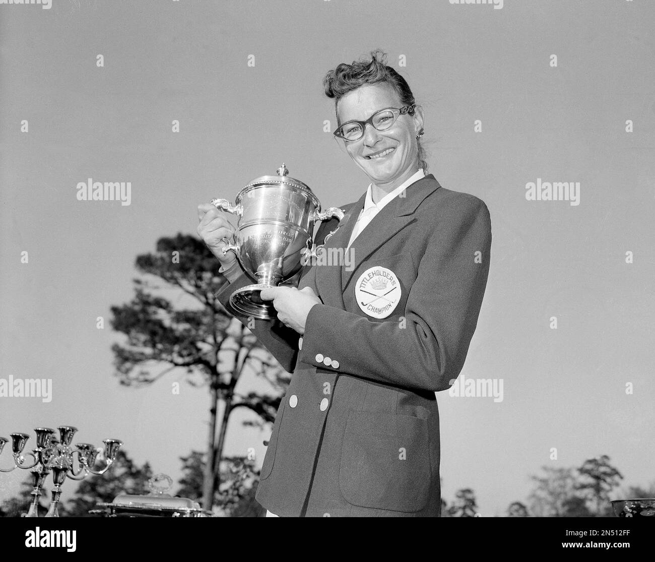 Beverly Hanson of Indio, Calif., is all smiles as she holds the winner ...