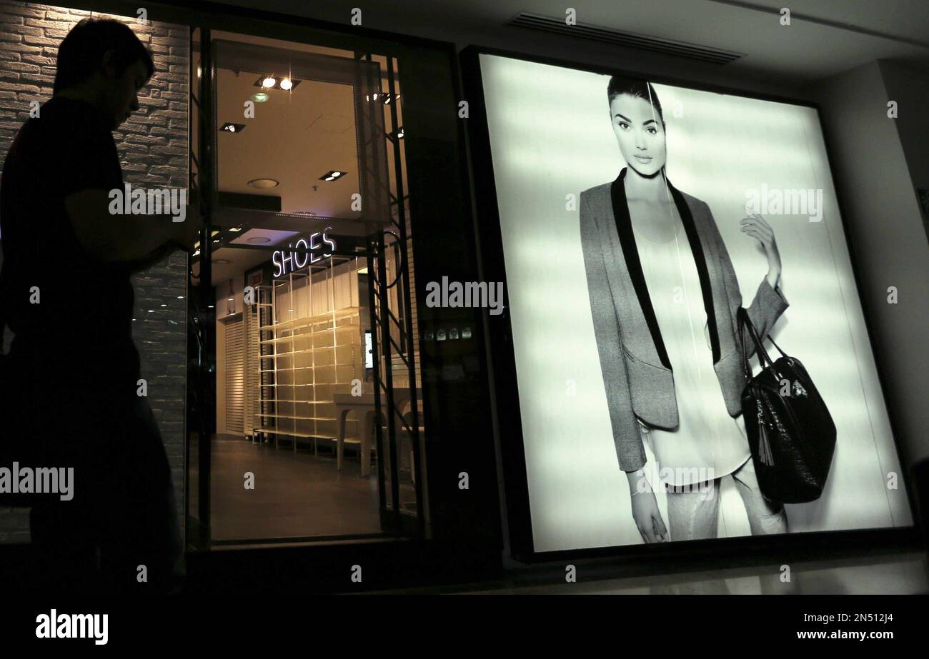 In this Jan. 28, 2014 photo, a shoe display sits empty inside a store at the Tolon Mall in ...