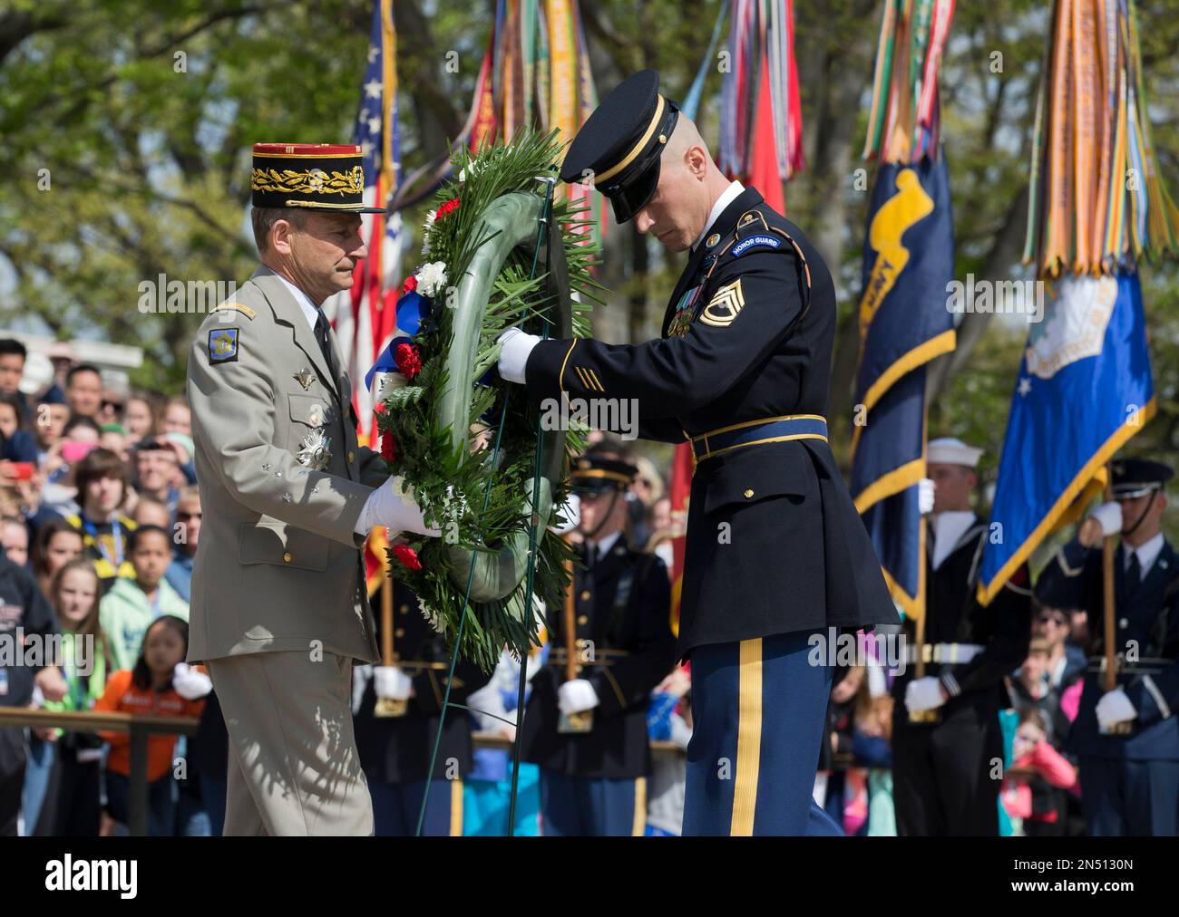 French Chief of Defense Gen. Pierre de Villiers, left, is assisted as ...
