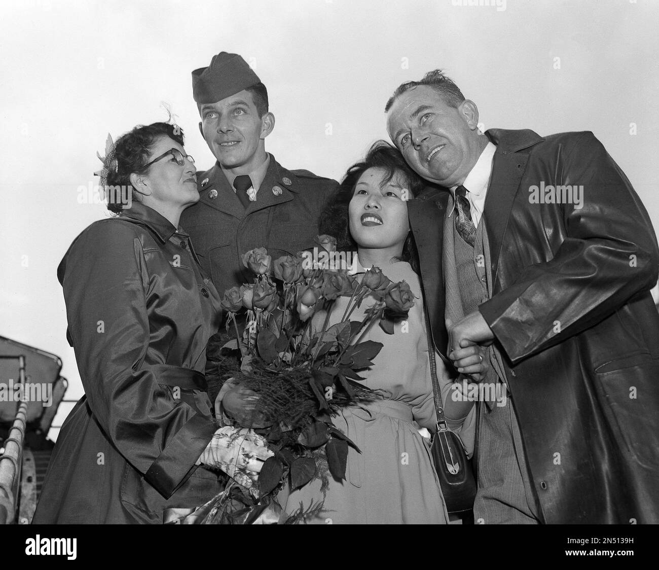 Lee Yong Soon Morgan, 23, first Korean war bride to arrive in the U.S. in Seattle, Wash., smiles ...