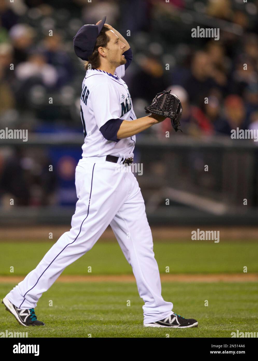 Seattle Mariners relief pitcher Danny Farquhar reacts after a run ...