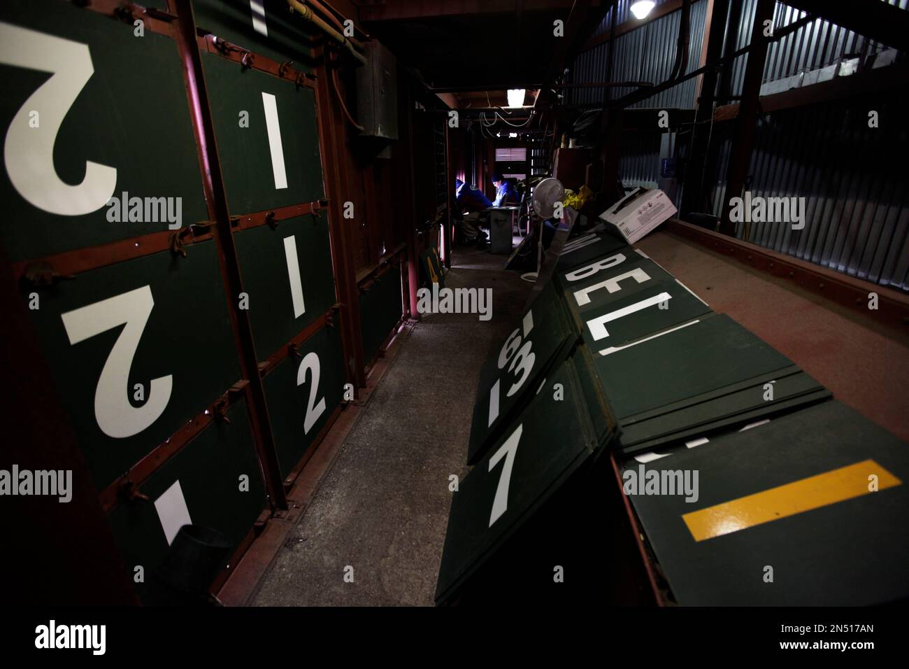 In this April 10, 2014 photo, metal plates of team names and numeral ...