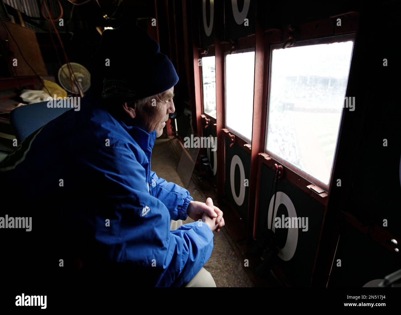 In this April 10, 2014 photo, scoreboard operator Brian Helmus looks ...