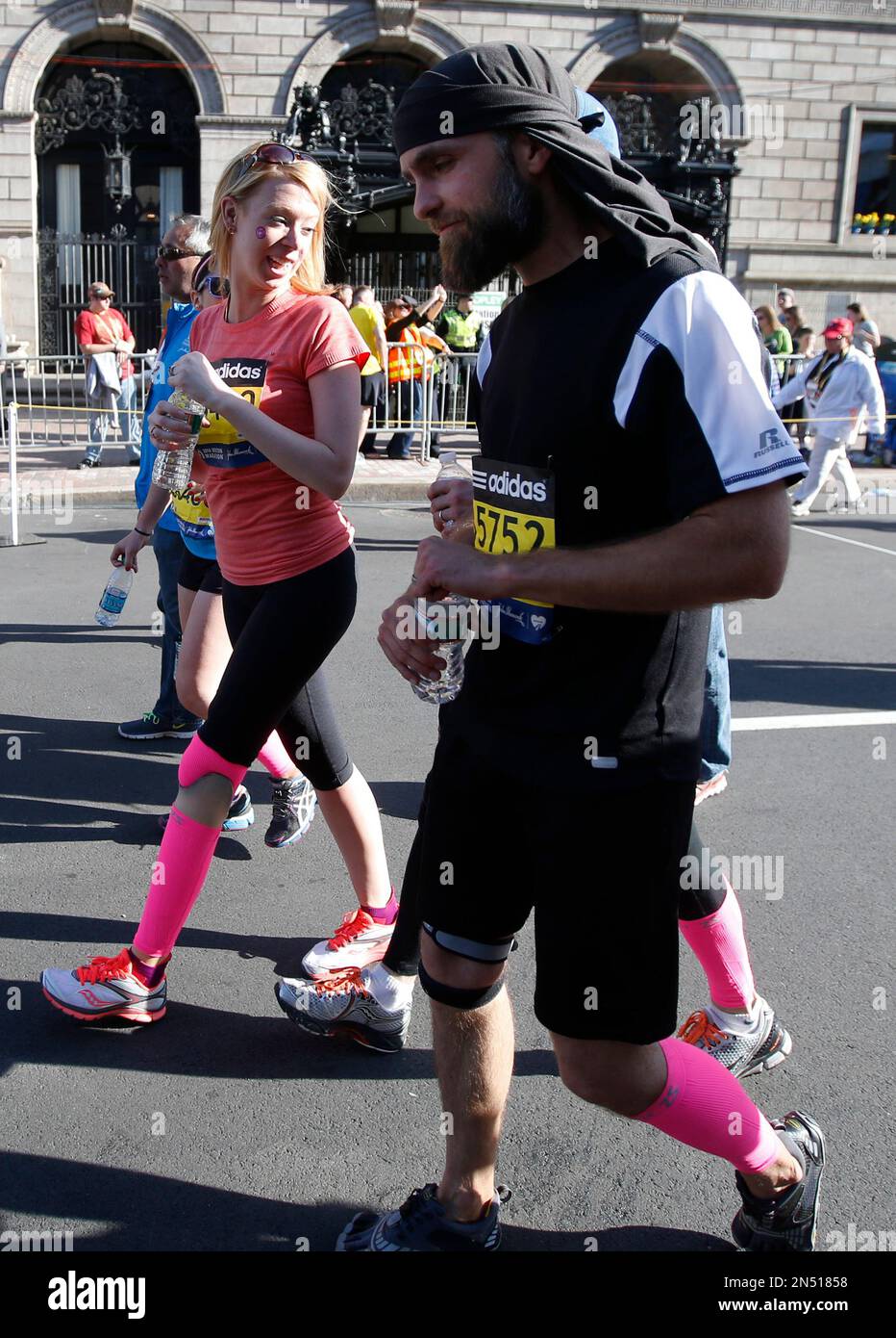 Adrianne Haslet-Davis, left, and her brother David Haslet, right, walk ...