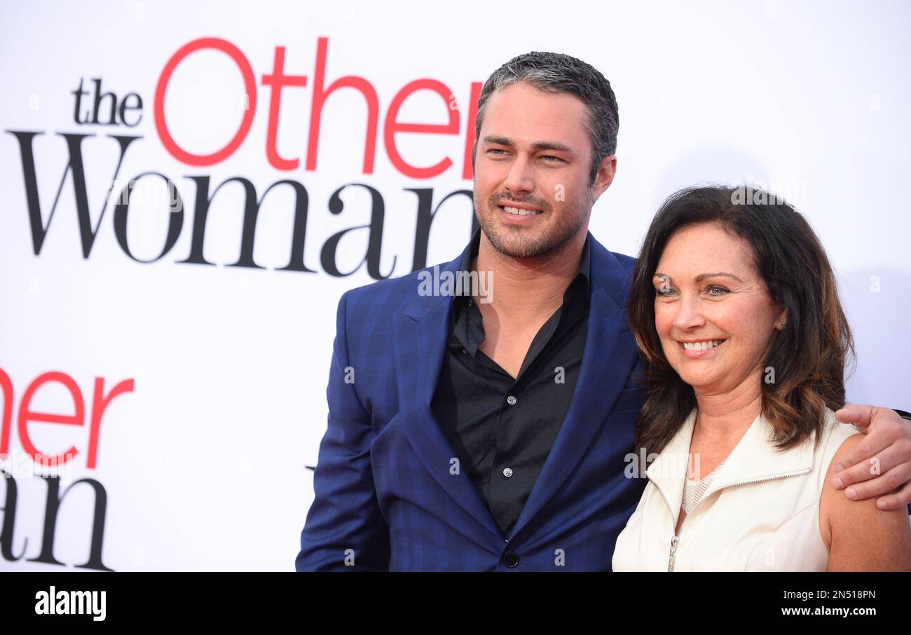 Taylor Kinney, left, and Pamela Heisler arrive at the Los Angeles ...