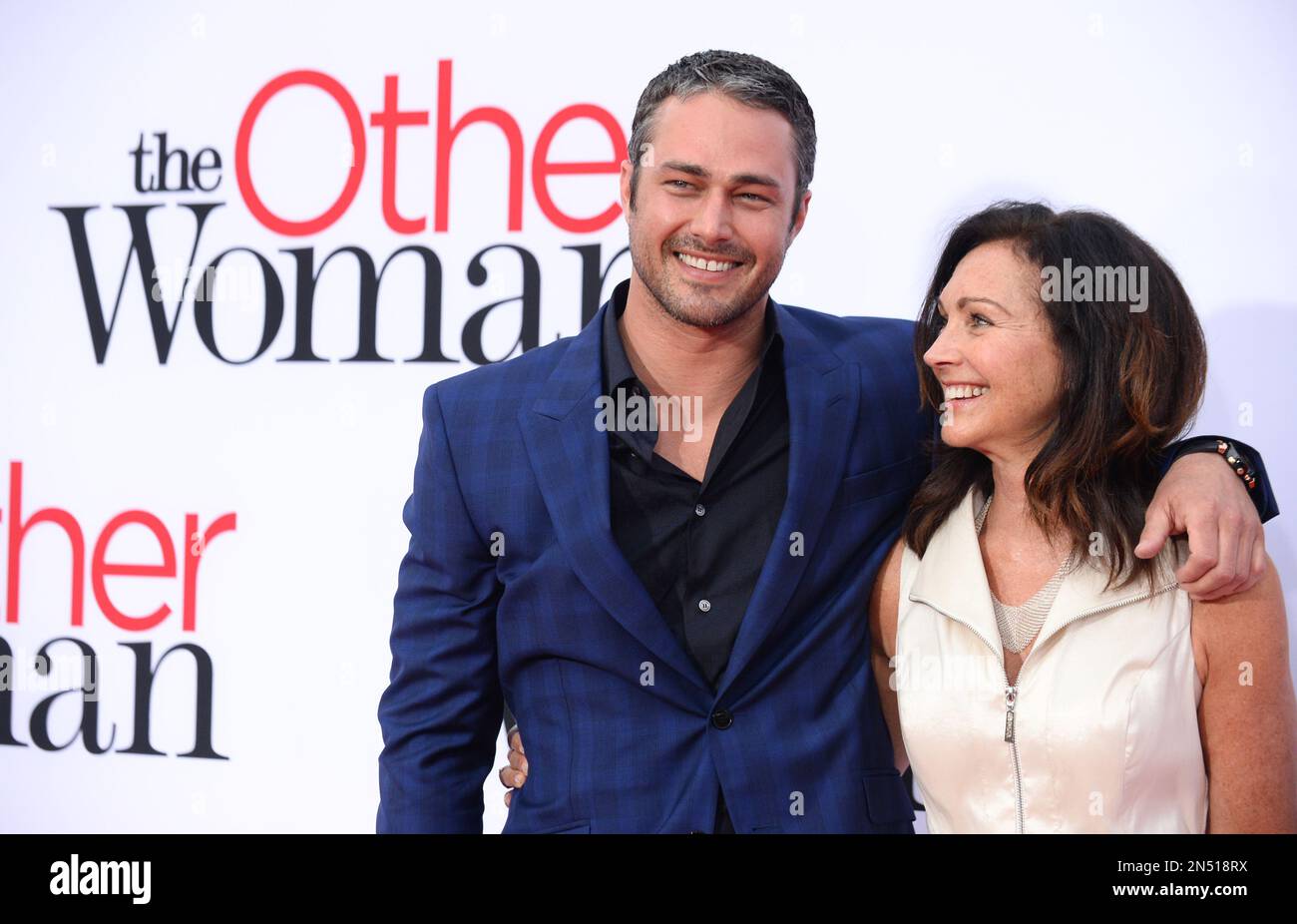 Taylor Kinney, left, and Pamela Heisler arrive at the Los Angeles ...