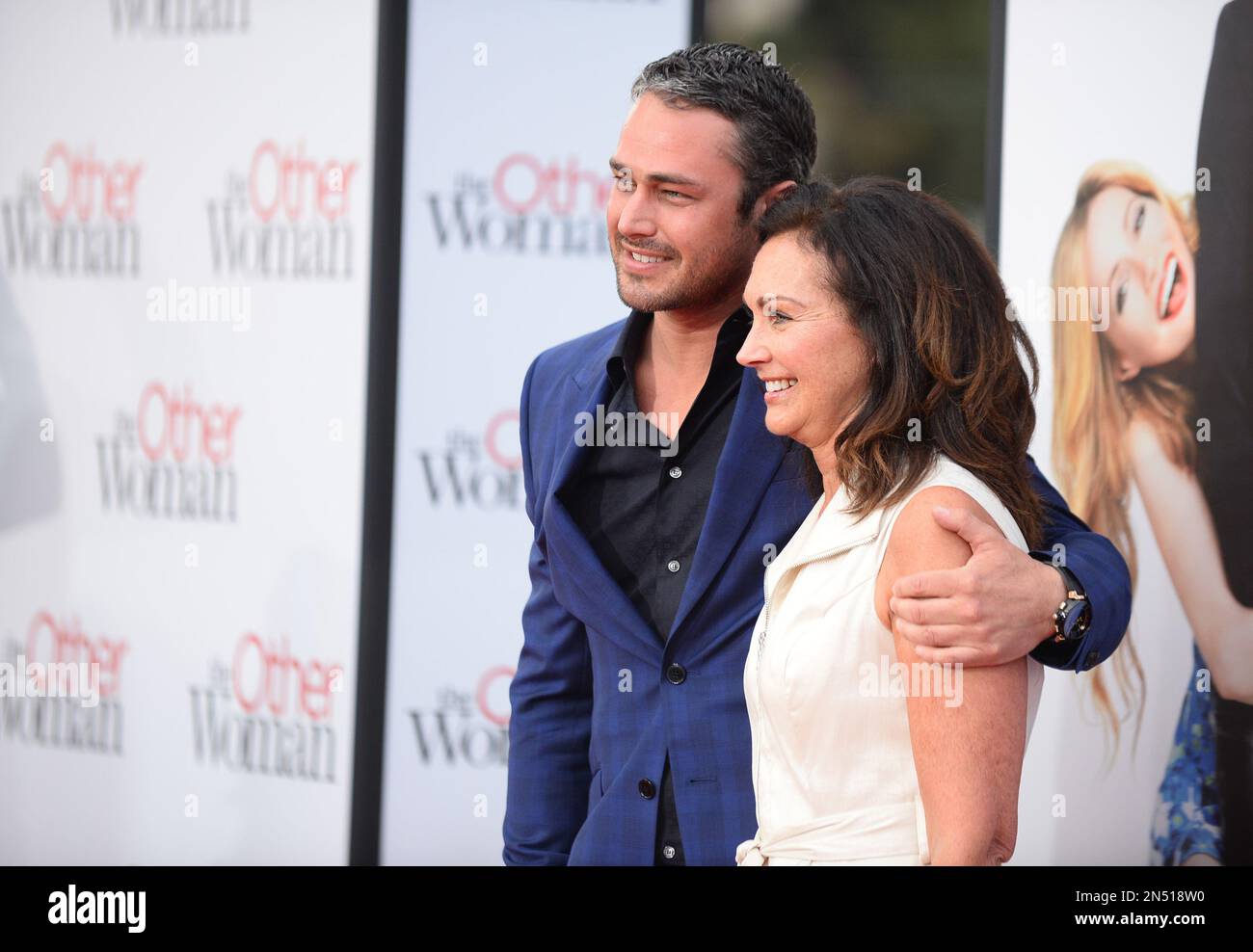 Taylor Kinney, left, and Pamela Heisler arrive at the Los Angeles ...