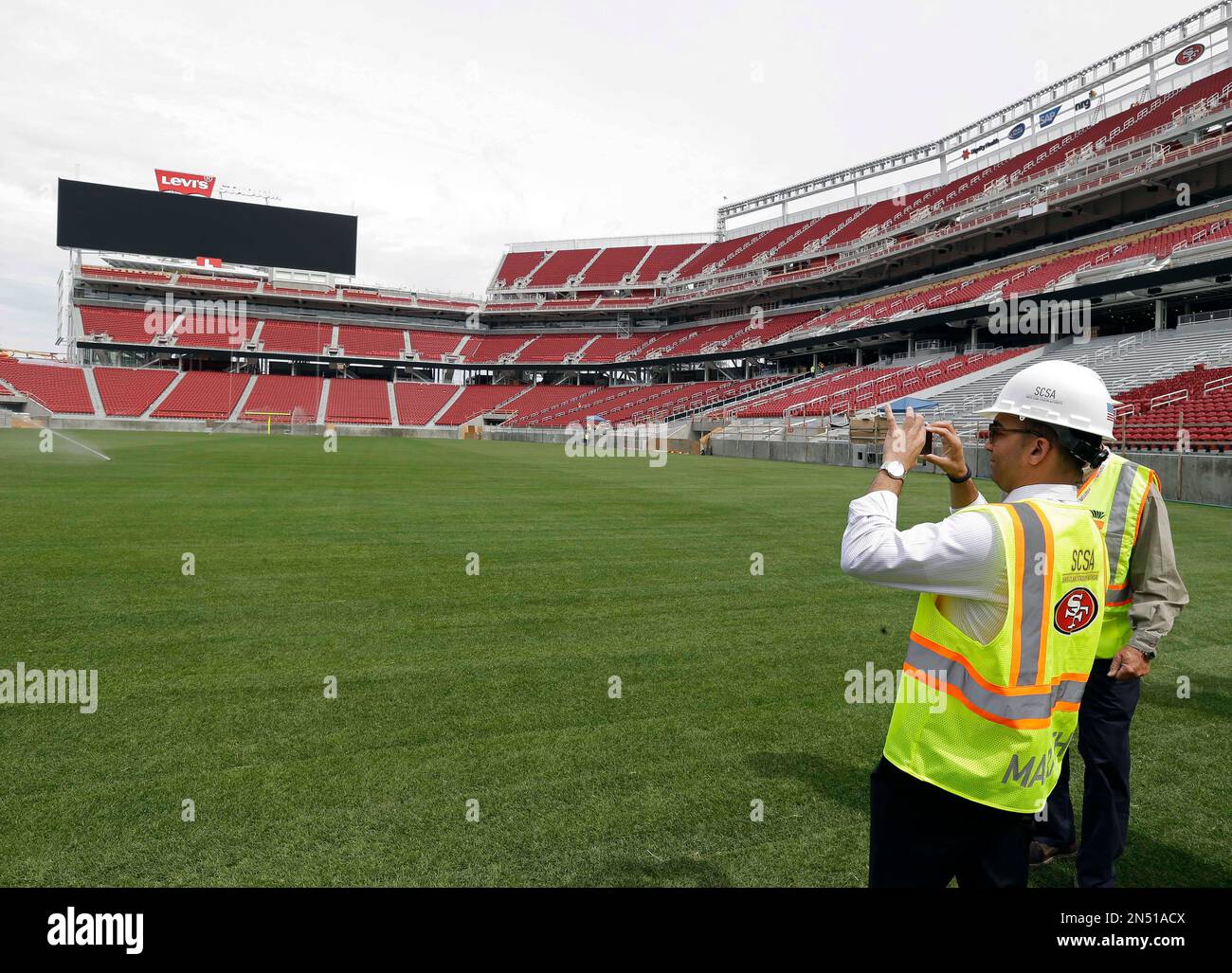 San Francisco 49ers president Paraag Marathe takes pictures of the ...