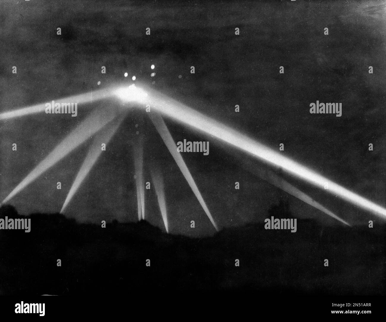 Anti-aircraft guns pump shells into a patch of sky on which numerous ...