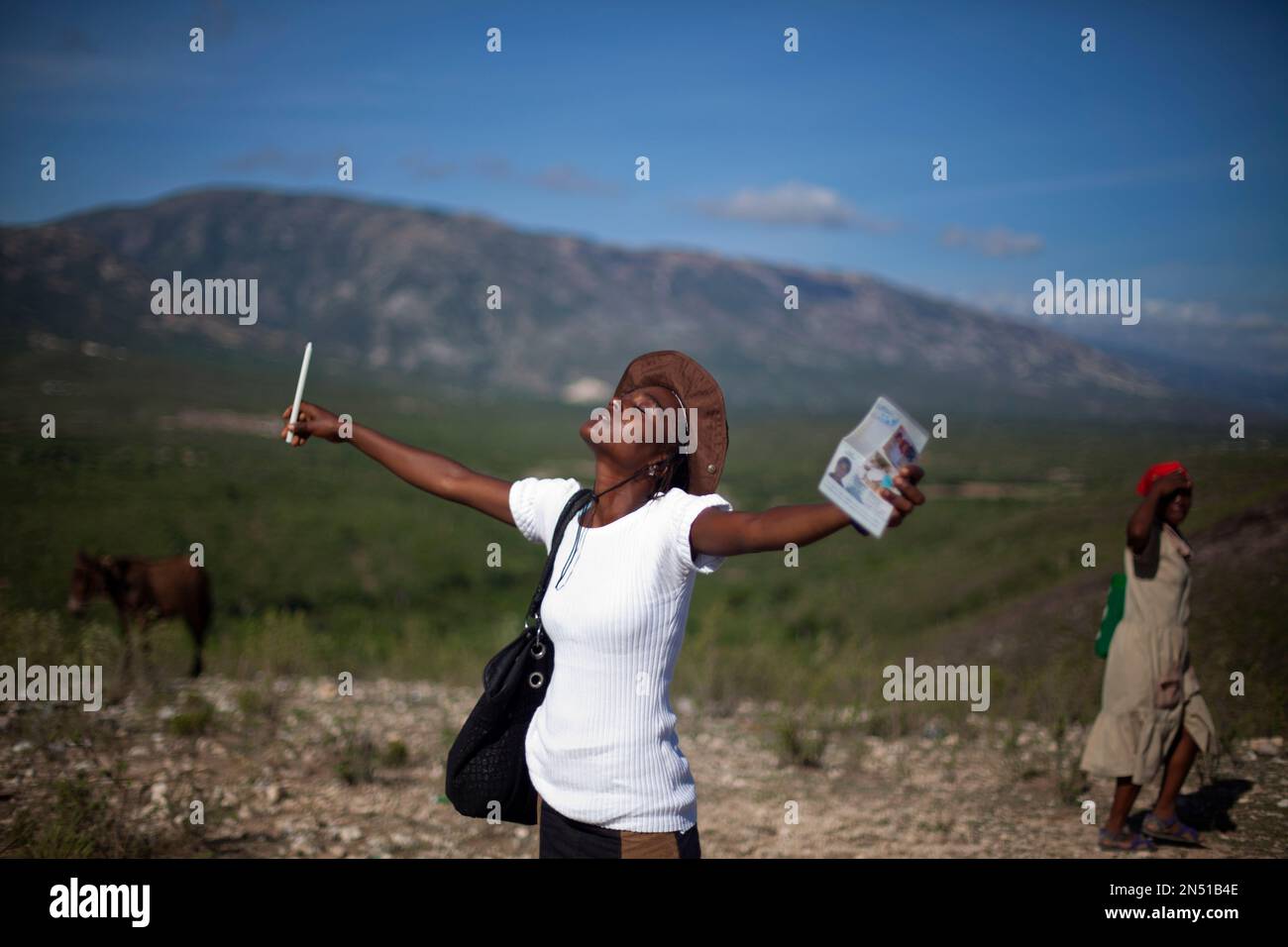 In this April 18, 2014 photo, a woman prays during a pilgrimage to ...