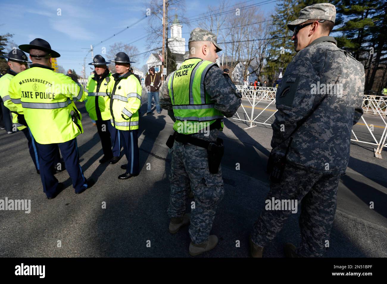 Massachusetts State Police and military police gather before the start ...