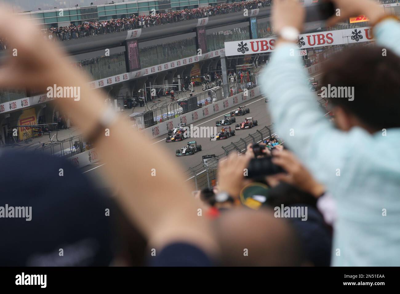 Mercedes driver Lewis Hamilton of Britain leads at the start of the ...