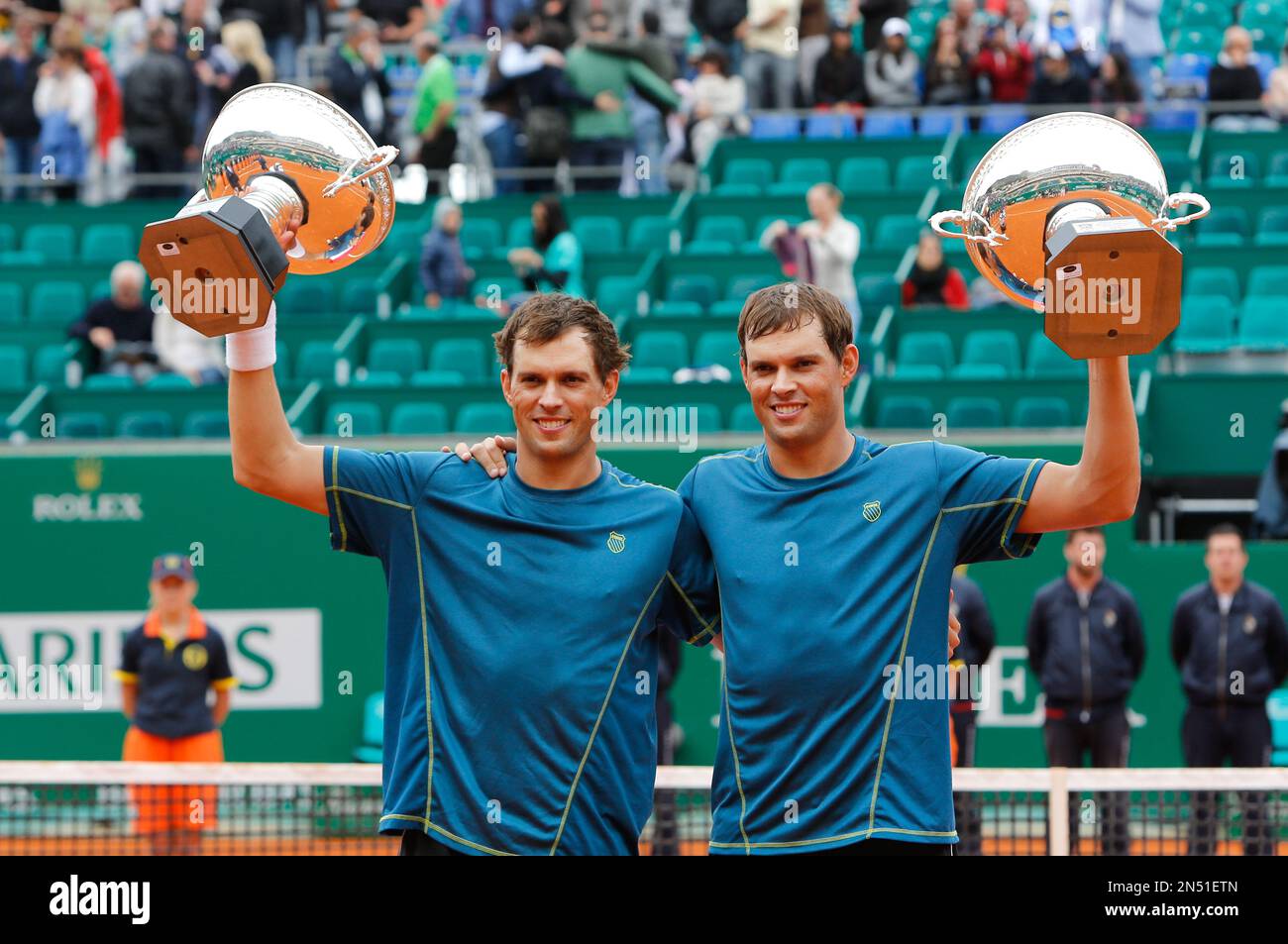 U.S. players Mike Bryan, left, and Bob Bryan display their trophies ...