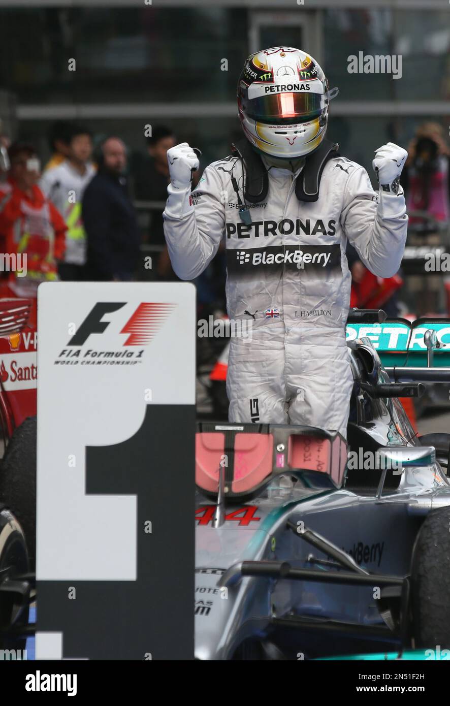 Mercedes driver Lewis Hamilton of Britain celebrates after winning the ...