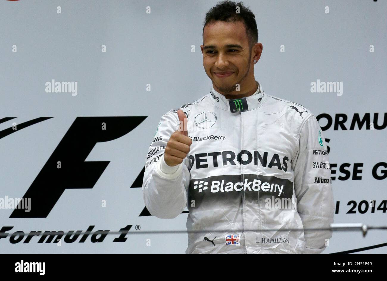 Mercedes driver Lewis Hamilton of Britain gestures during the prize ...
