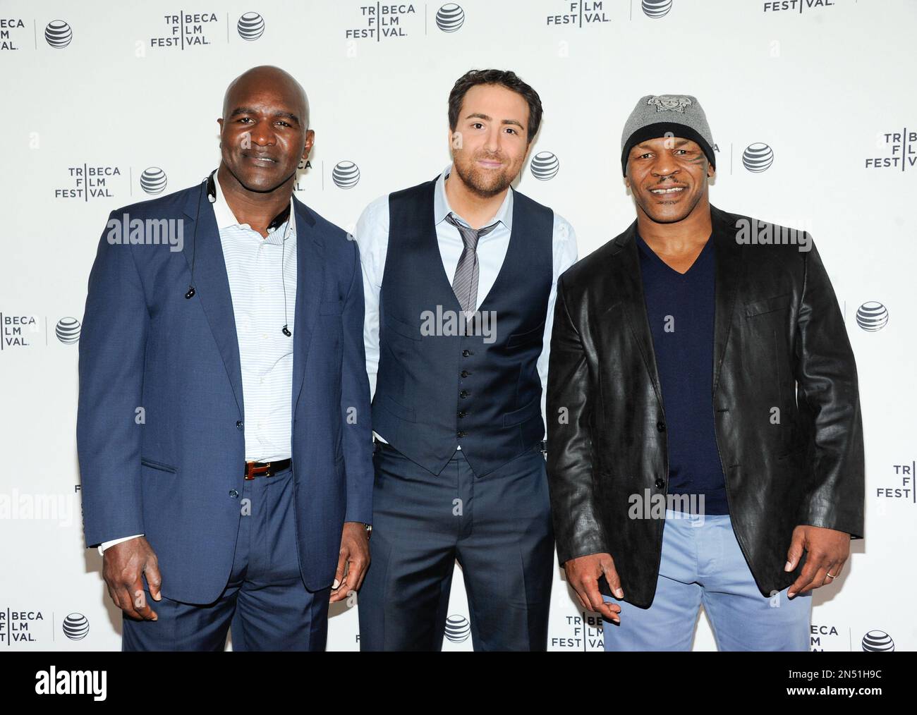 Retired professional boxers Evander Holyfield, left, and Mike Tyson ...