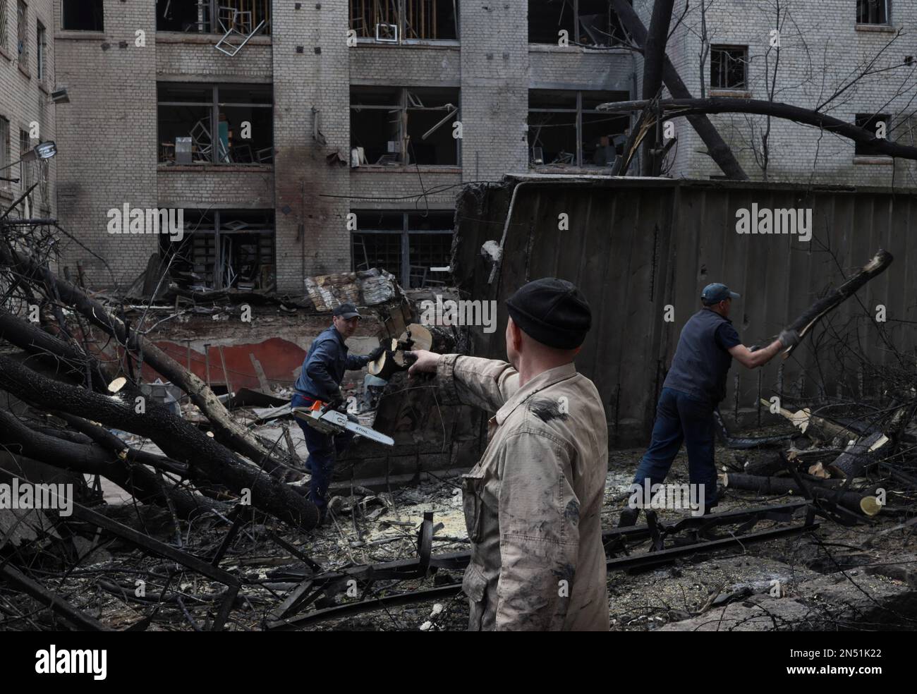 kyiv, Ukraine, 04-29-2022: Men remove rubble from a building destroyed ...