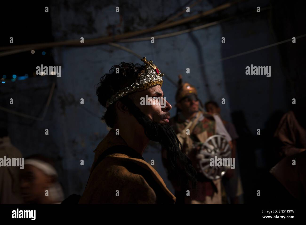A man dressed as a Roman Soldier participates in the reenactment of the ...