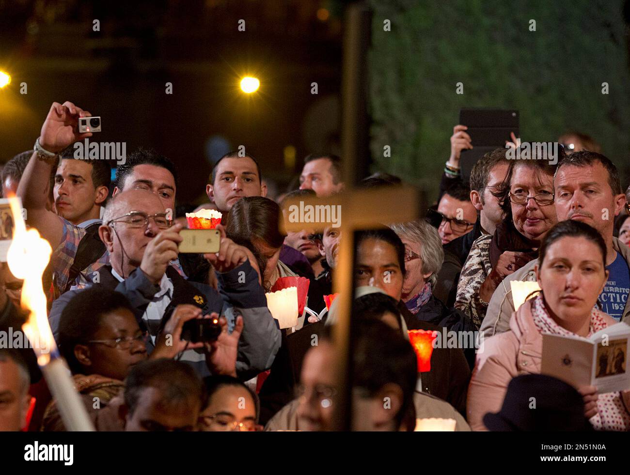 Faithful attend the Via Crucis (Way of the Cross) torchlight procession ...