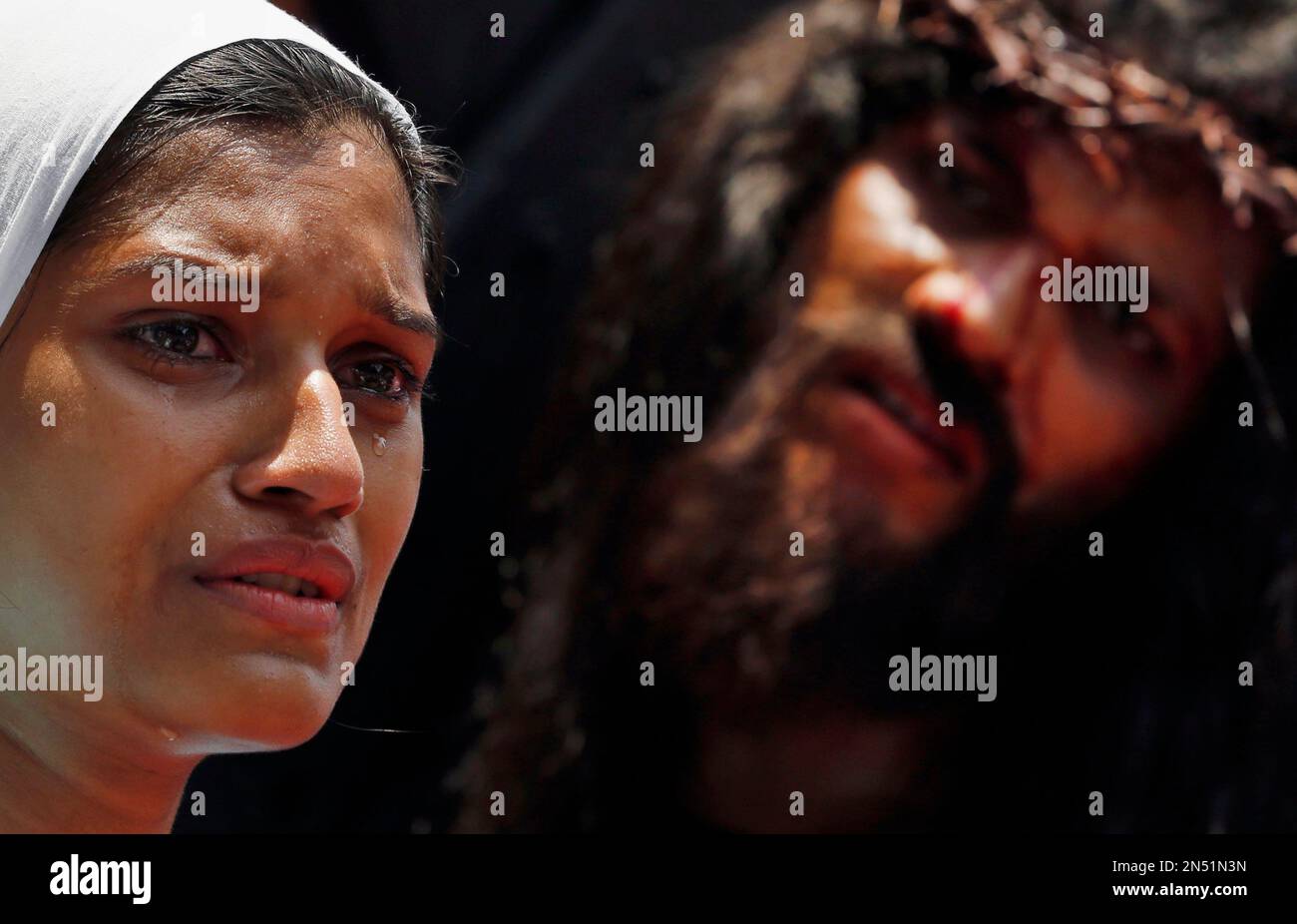 Indian Christian devotees re-enact the crucifixion of Jesus Christ to ...