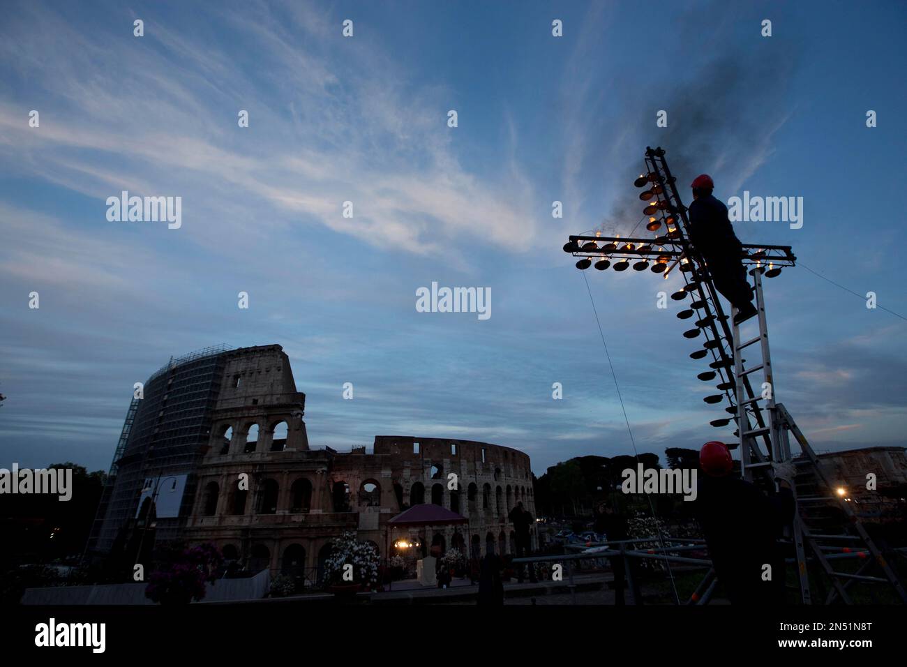 A cross is lighten before the start of the Via Crucis (Way of the Cross ...