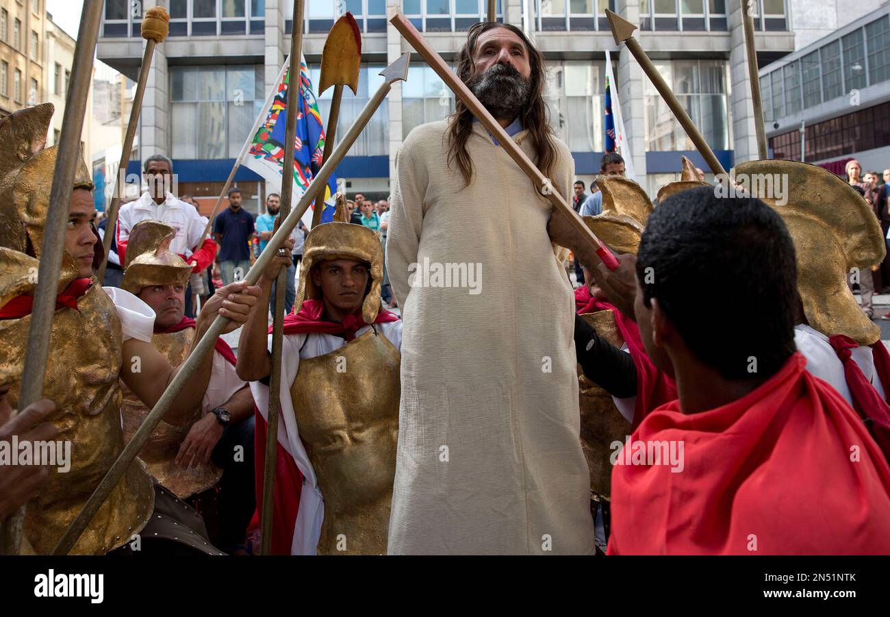 Church volunteers and homeless people reenact the steps of Jesus Christ ...