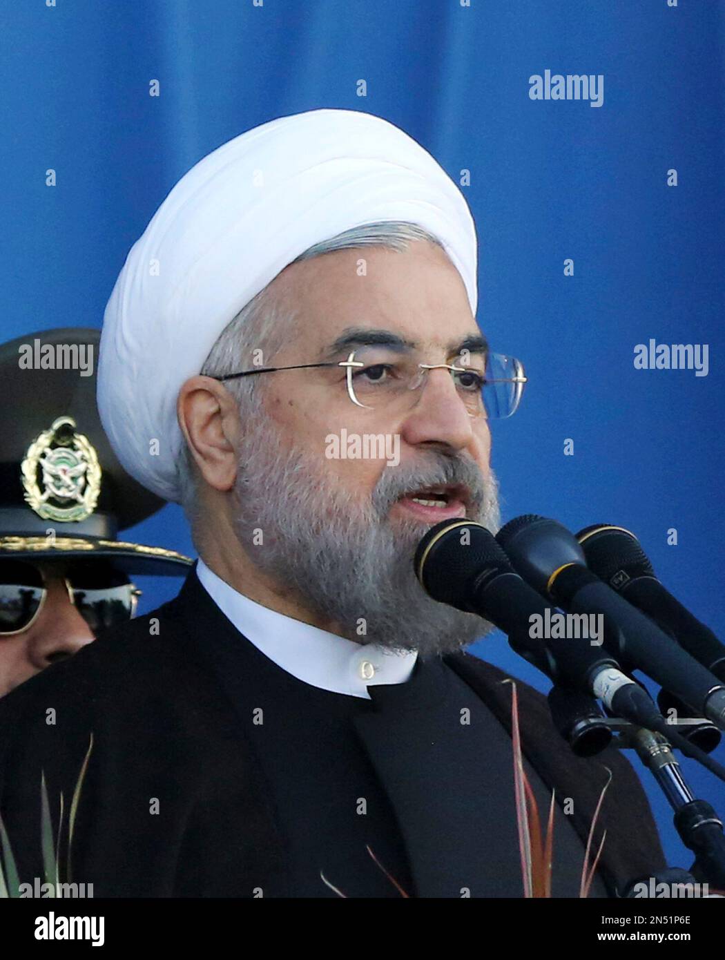 Iranian President Hassan Rouhani speaks in a military parade marking ...