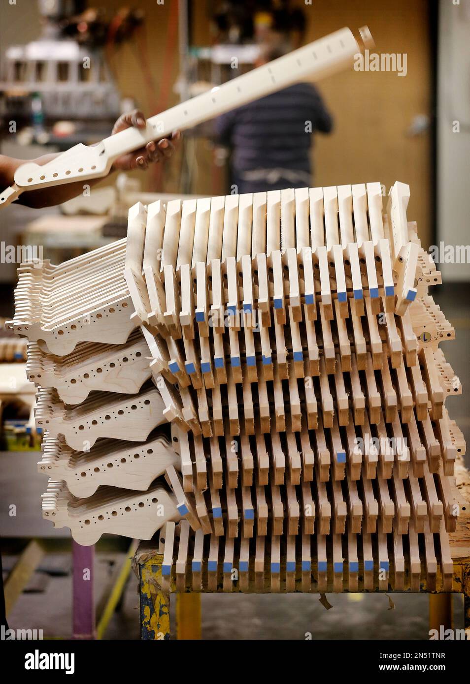 Fender Stratocaster electric guitar necks are prepared for assembly at ...