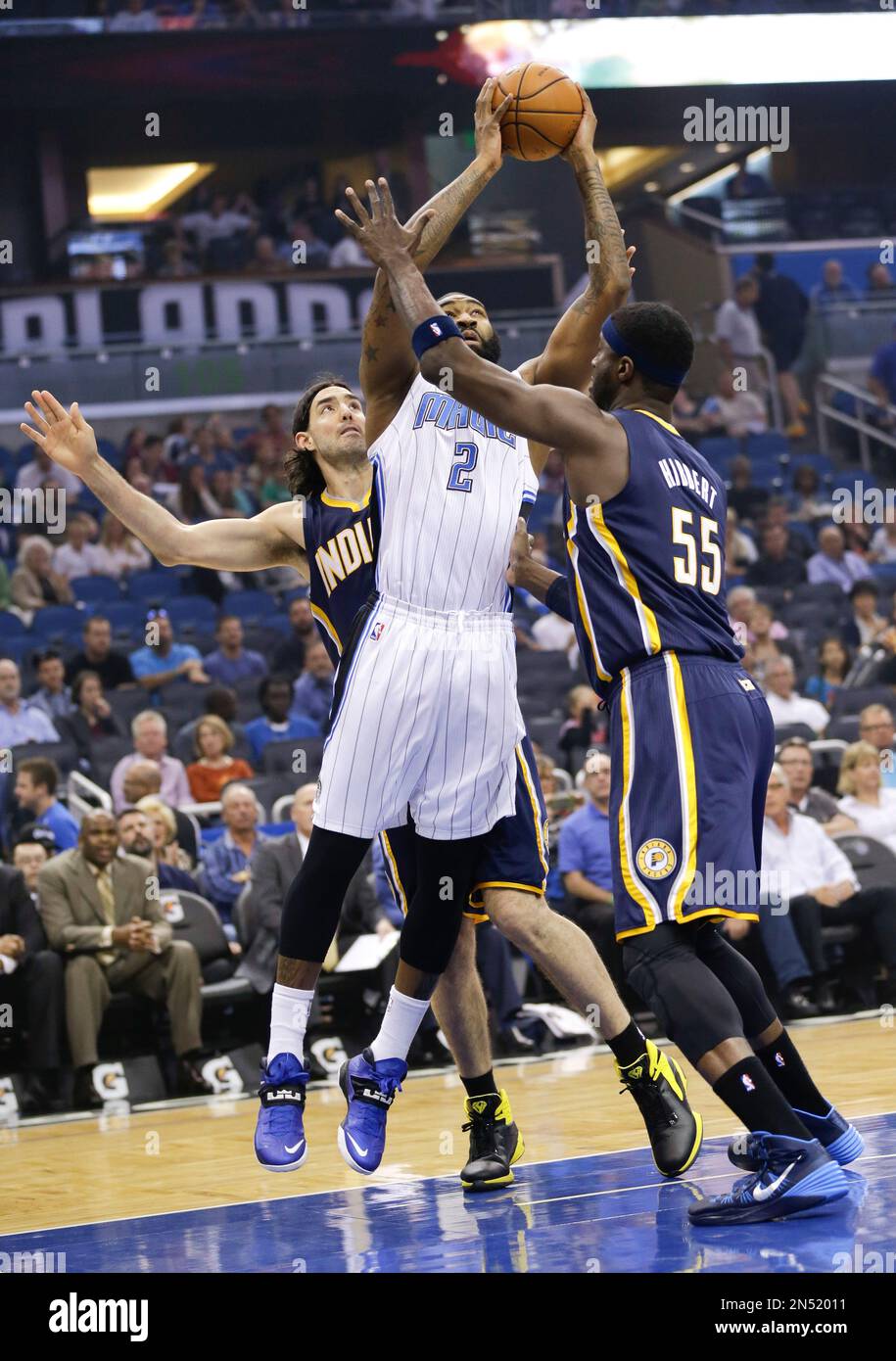 Orlando Magic's Kyle O'Quinn (2) gets off a shot as he gets between ...