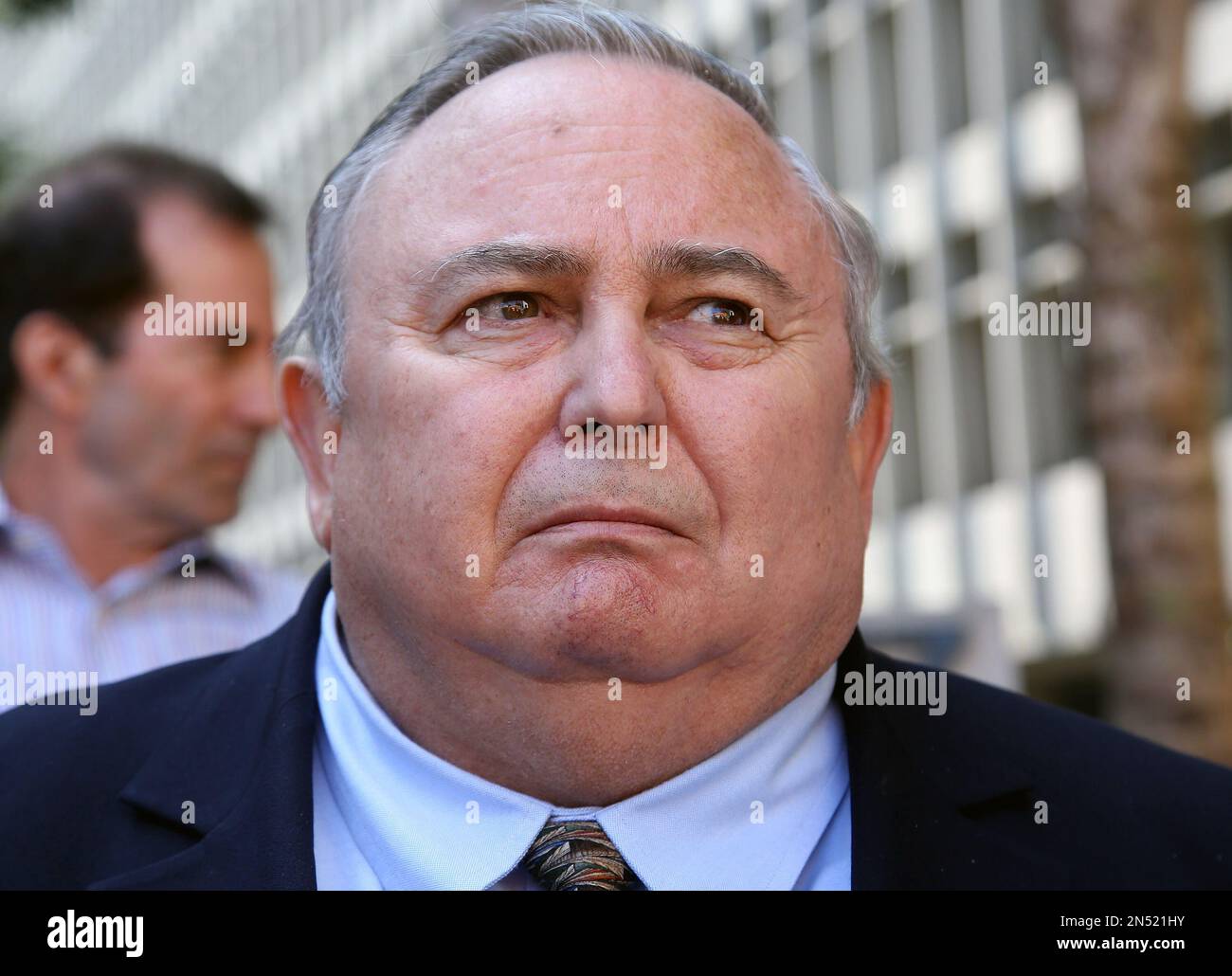 Robert Rizzo, left, leaves court after being sentenced, Wednesday April ...