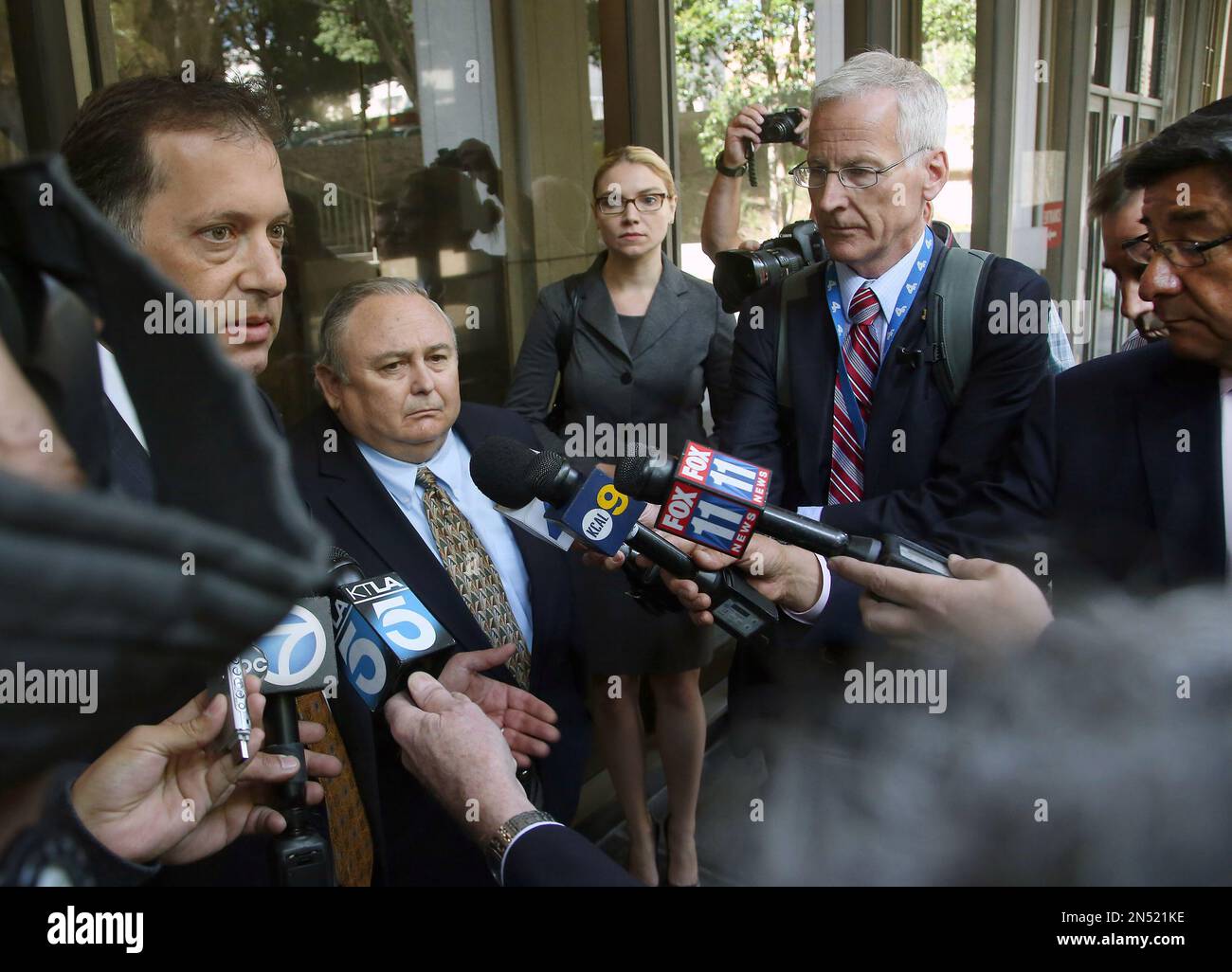 Robert Rizzo, left, leaves court after being sentenced, Wednesday April ...