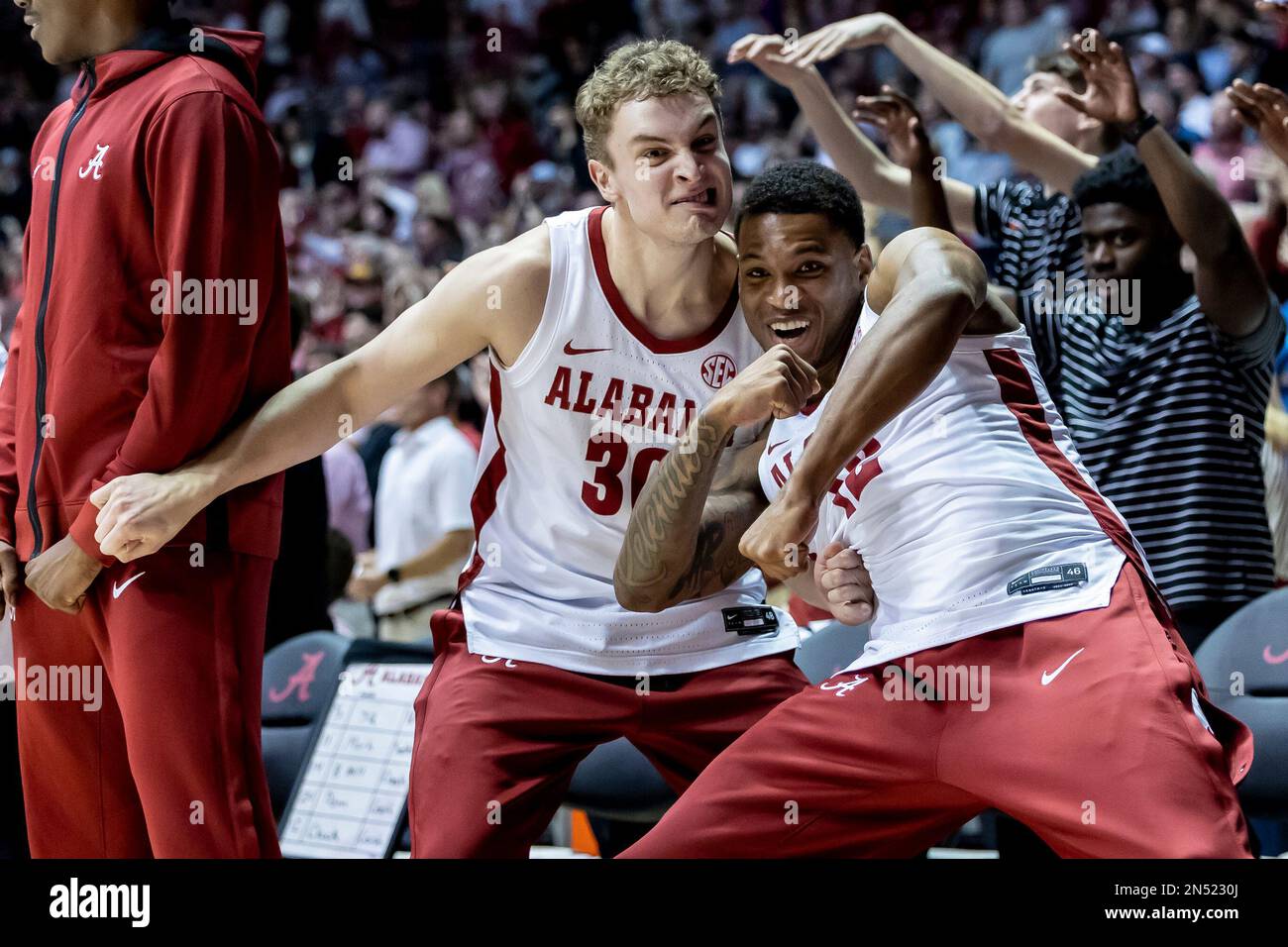 Alabama guard Adam Cottrell (30) and guard Delaney Heard (12) cheer a ...