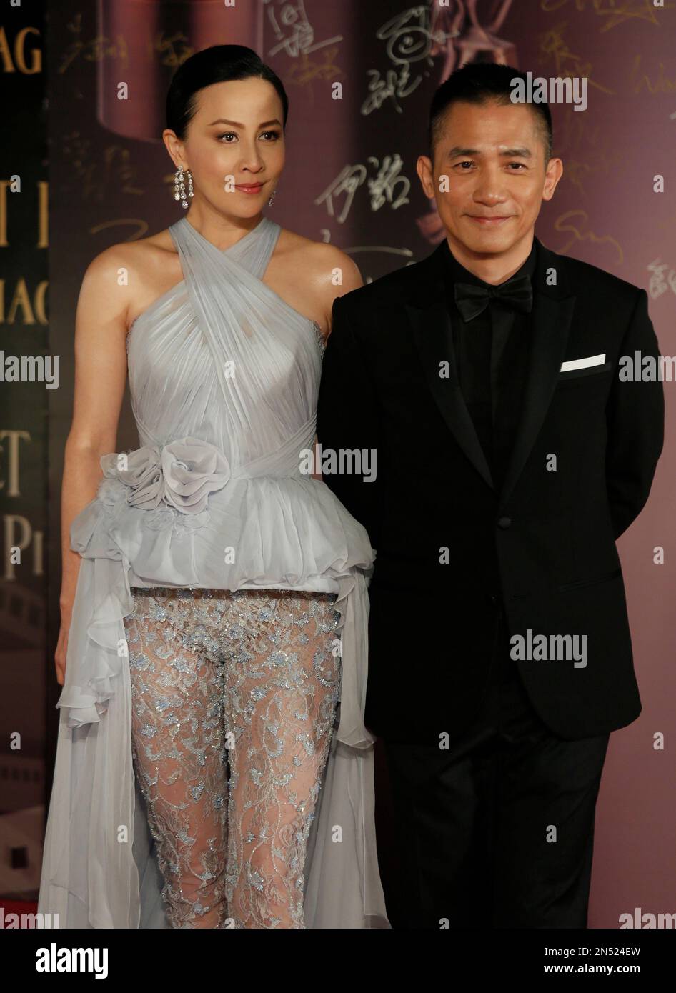 Hong Kong actor Tony Leung, right poses with his wife actress Carina ...