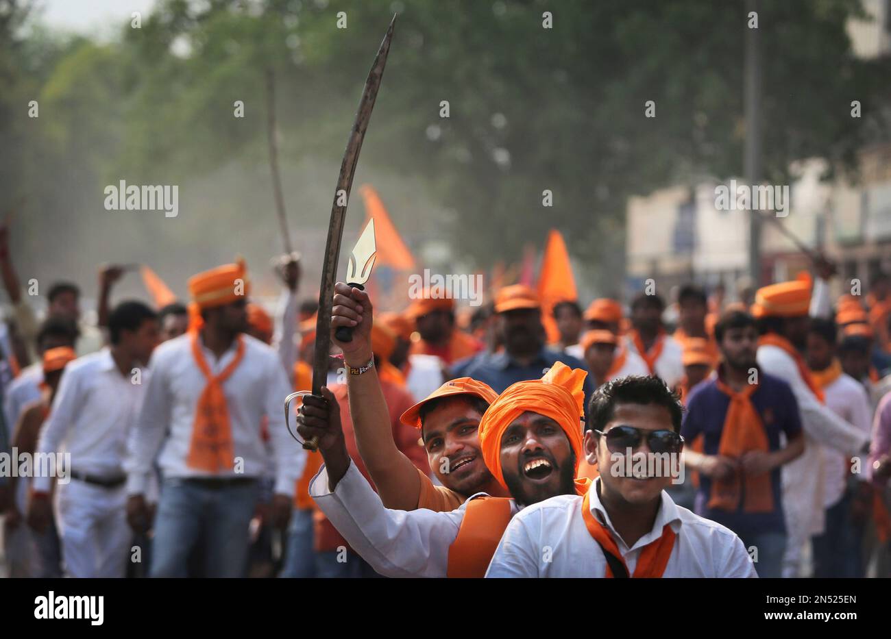 Indian activists, from different Hindu organizations, wielding swords ...