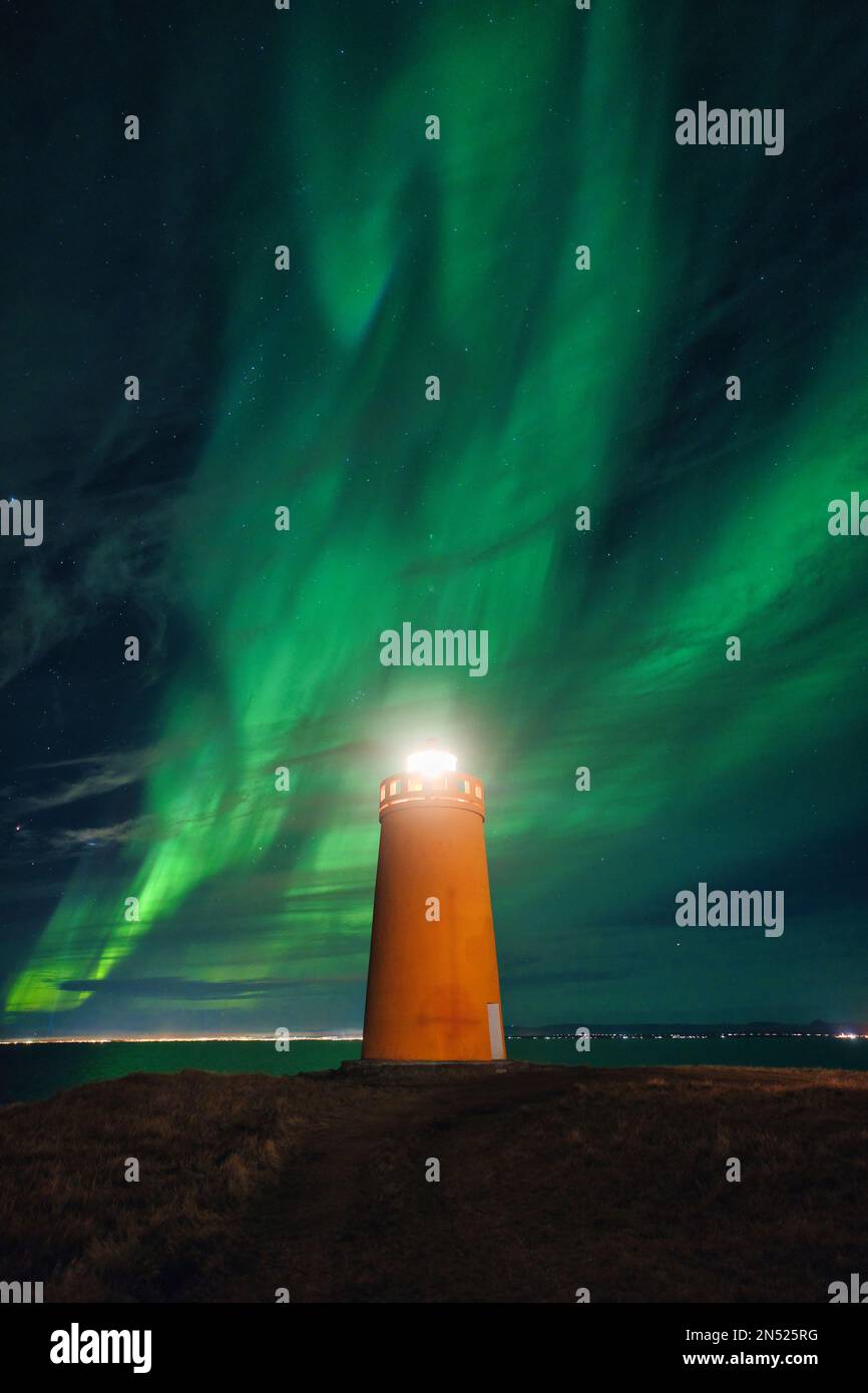 A northern lights aurora borealis over lighthouse in Iceland Stock ...