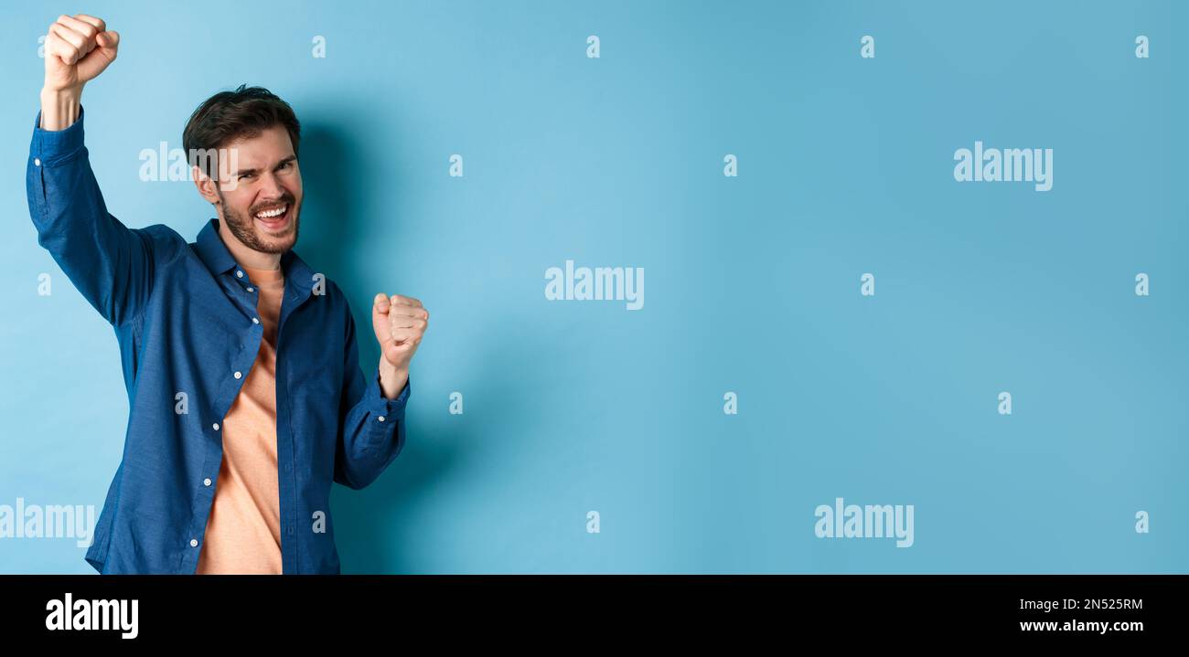 Lucky man celebrating victory, cheering and shouting yes with joy ...