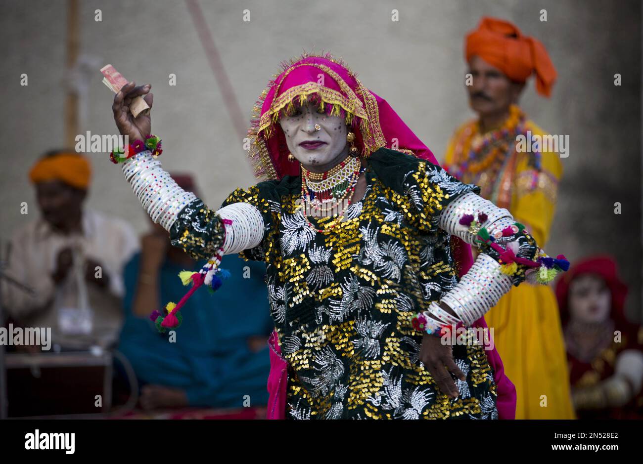 A Pakistani folk dancer from the Bheel nomad community performs at a ...