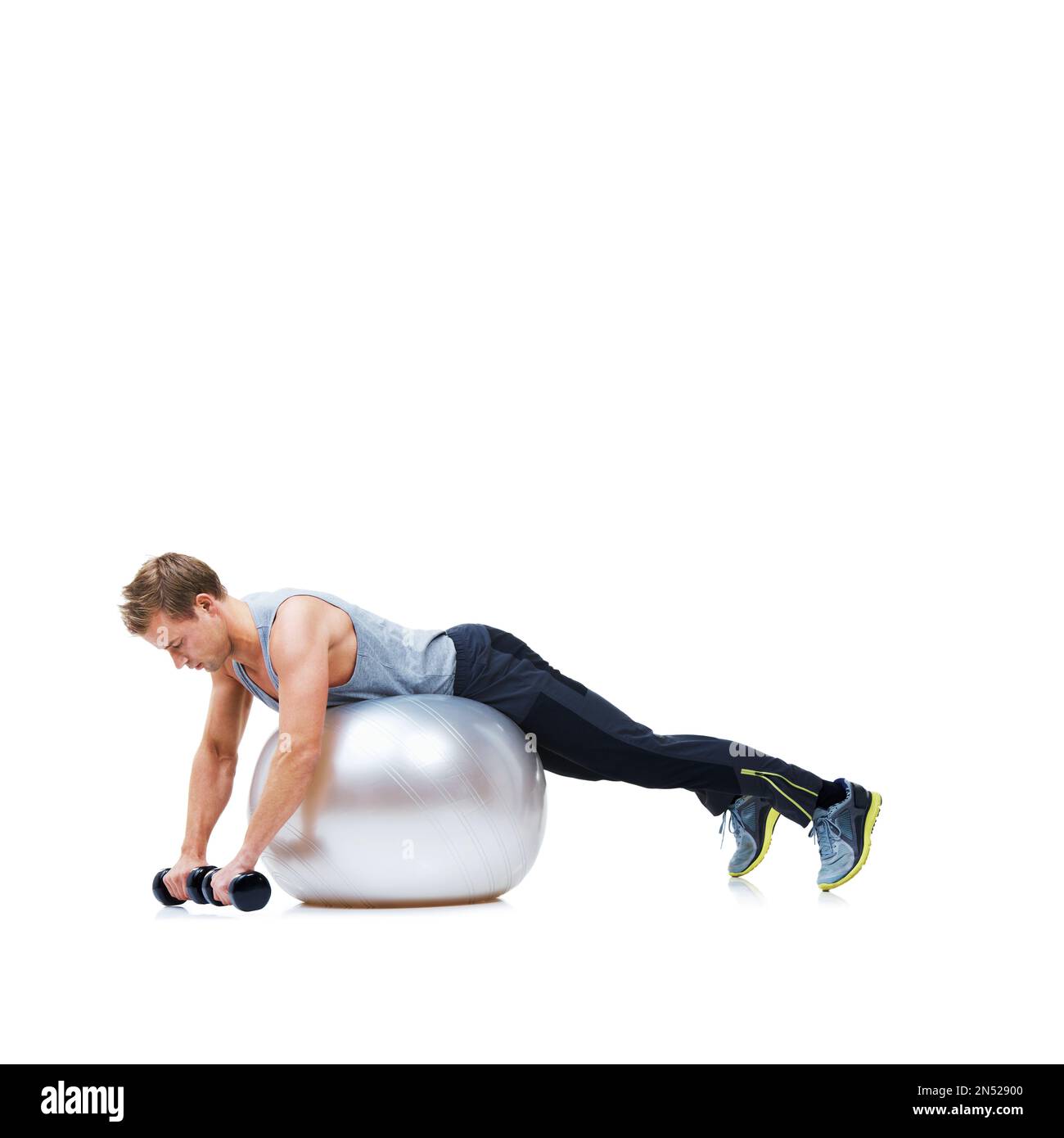 Working out without risking his back. a man balancing on an exercise ...