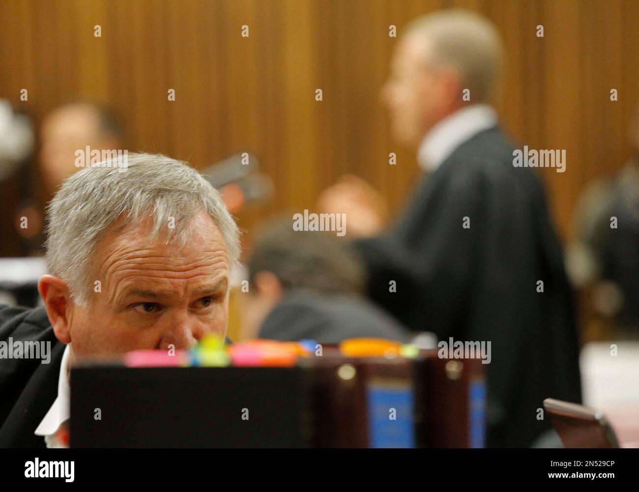 Barry Roux, defense attorney for Oscar Pistorius, listens as chief ...