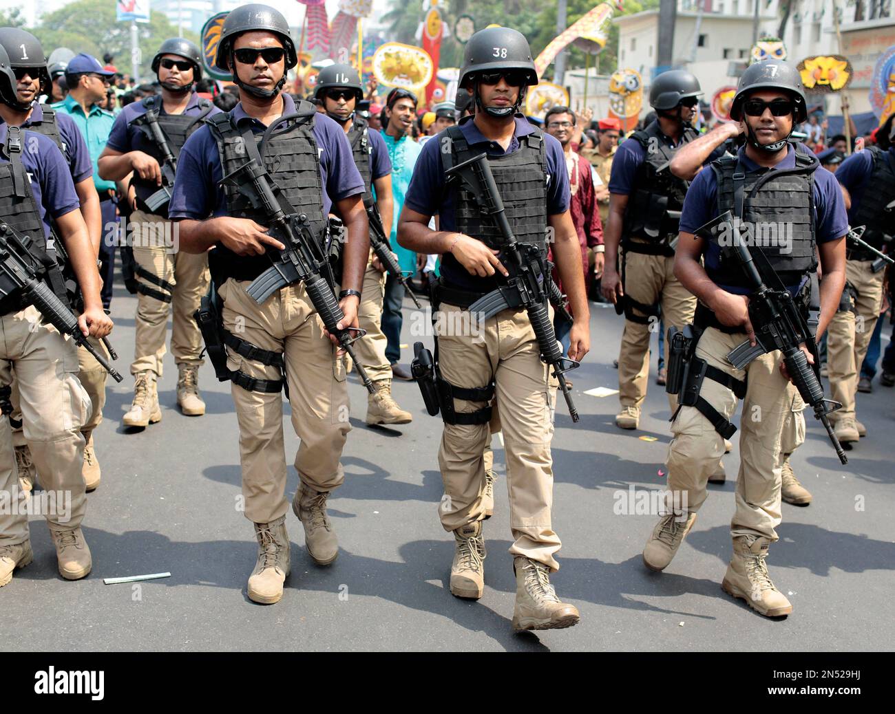 Bangladeshi special forces soldiers walk along with Bangladeshi people in a parade to celebrate ...